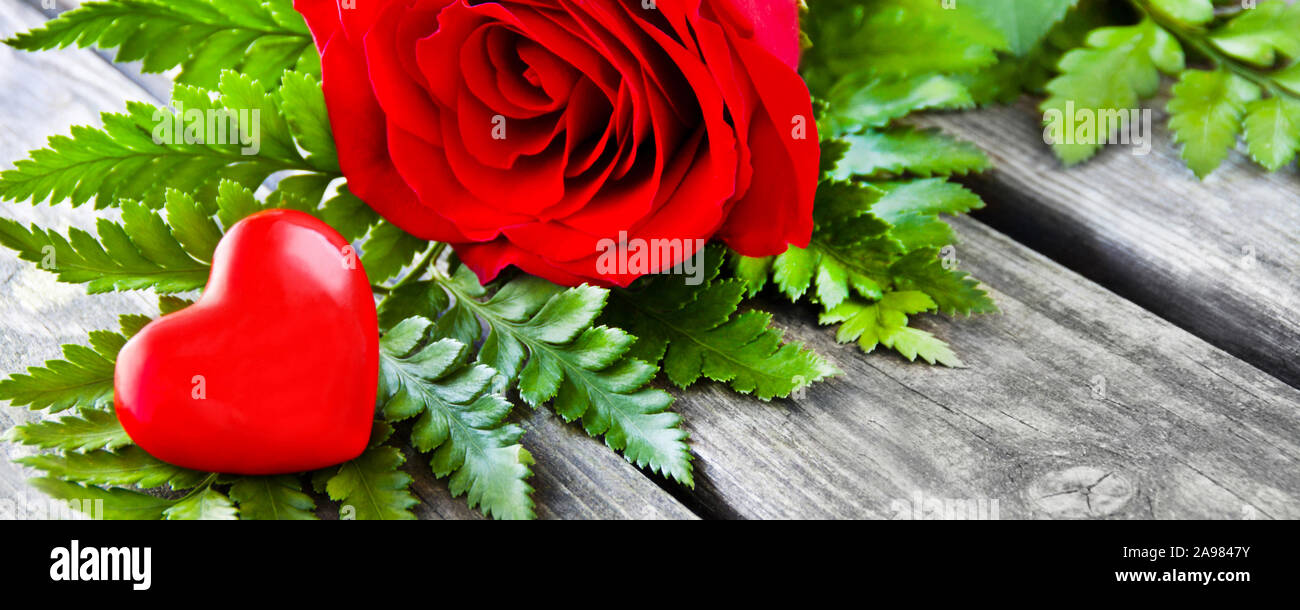 Red rose and heart Stock Photo - Alamy