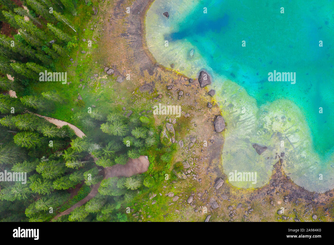 Aerial view of turquoise blue water of lake Carezza in Alps Dolomites ...