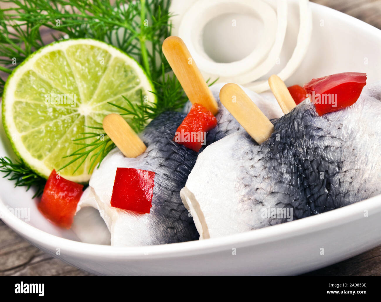 Pickled marinated herring rolls Stock Photo - Alamy
