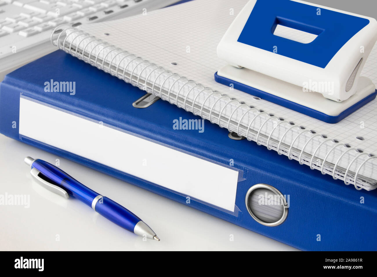 Office work blue file folder and pen Stock Photo - Alamy