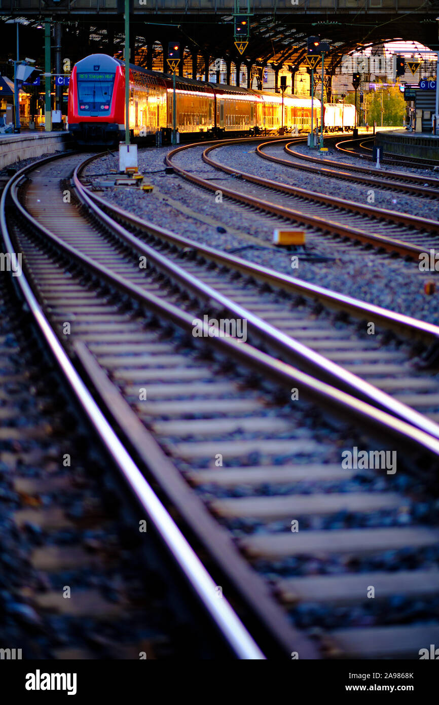 Train illuminated by the morning sun, morning atmosphere at Aachen ...