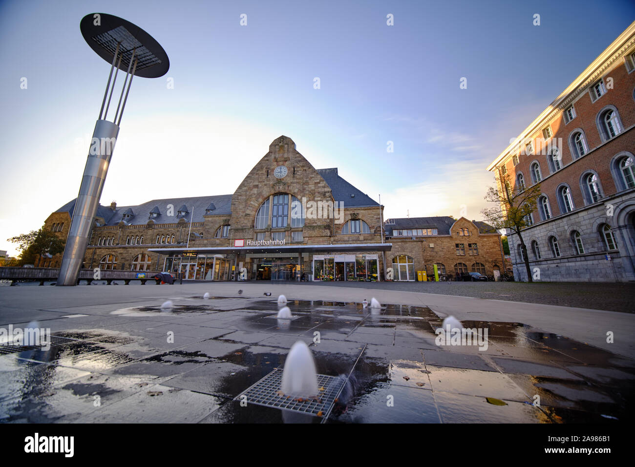 Morning atmosphere in front of the Central Station of Aachen, a spa ...