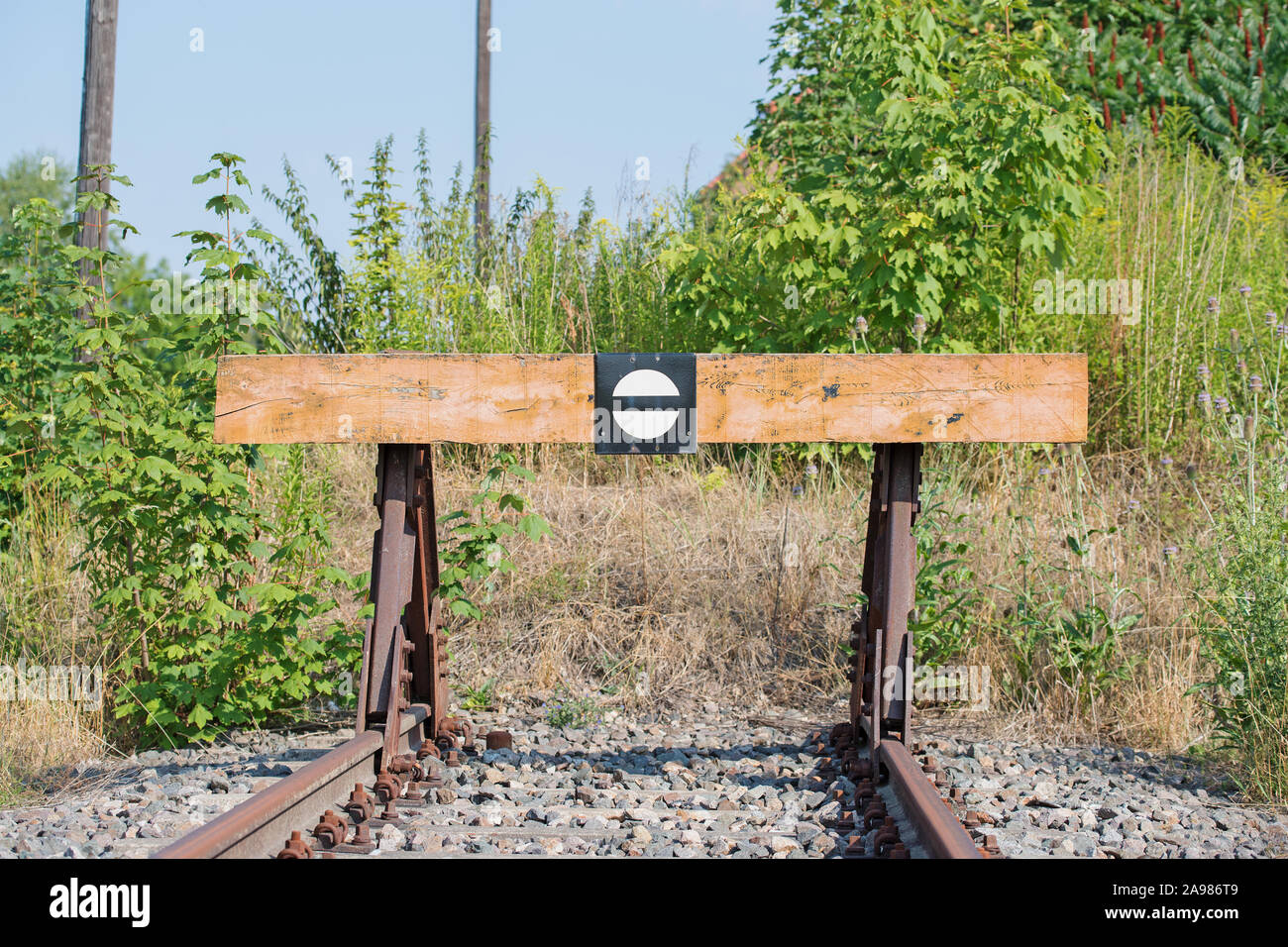 Siding track with buffer stop Stock Photo - Alamy