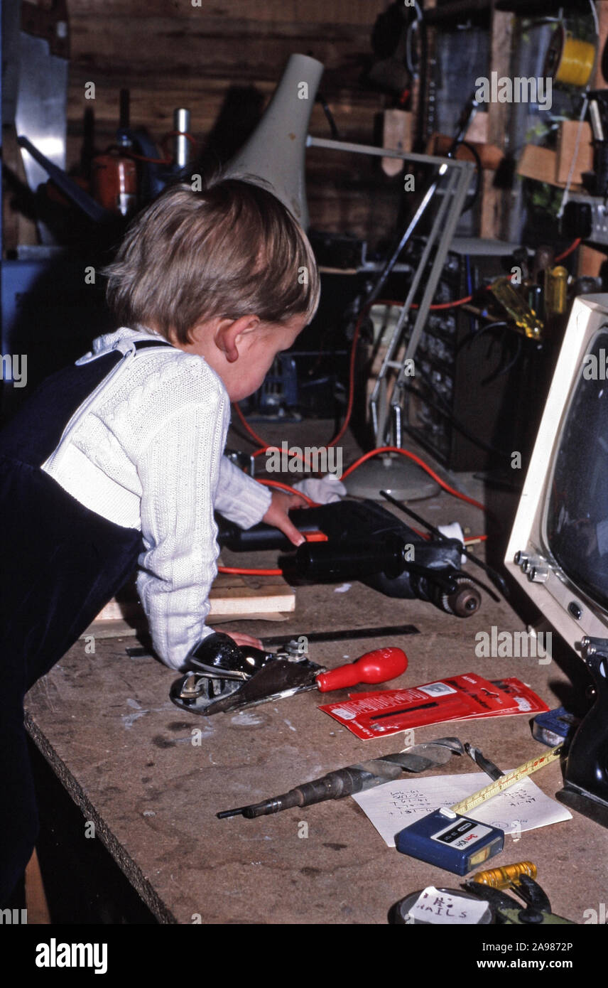 Young boy learning about Tools - Health & Safety Stock Photo - Alamy