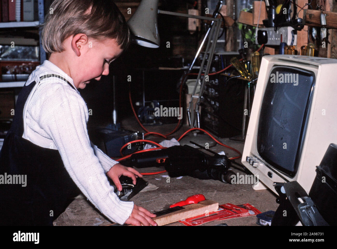Young boy learning about Tools - Health & Safety Stock Photo - Alamy