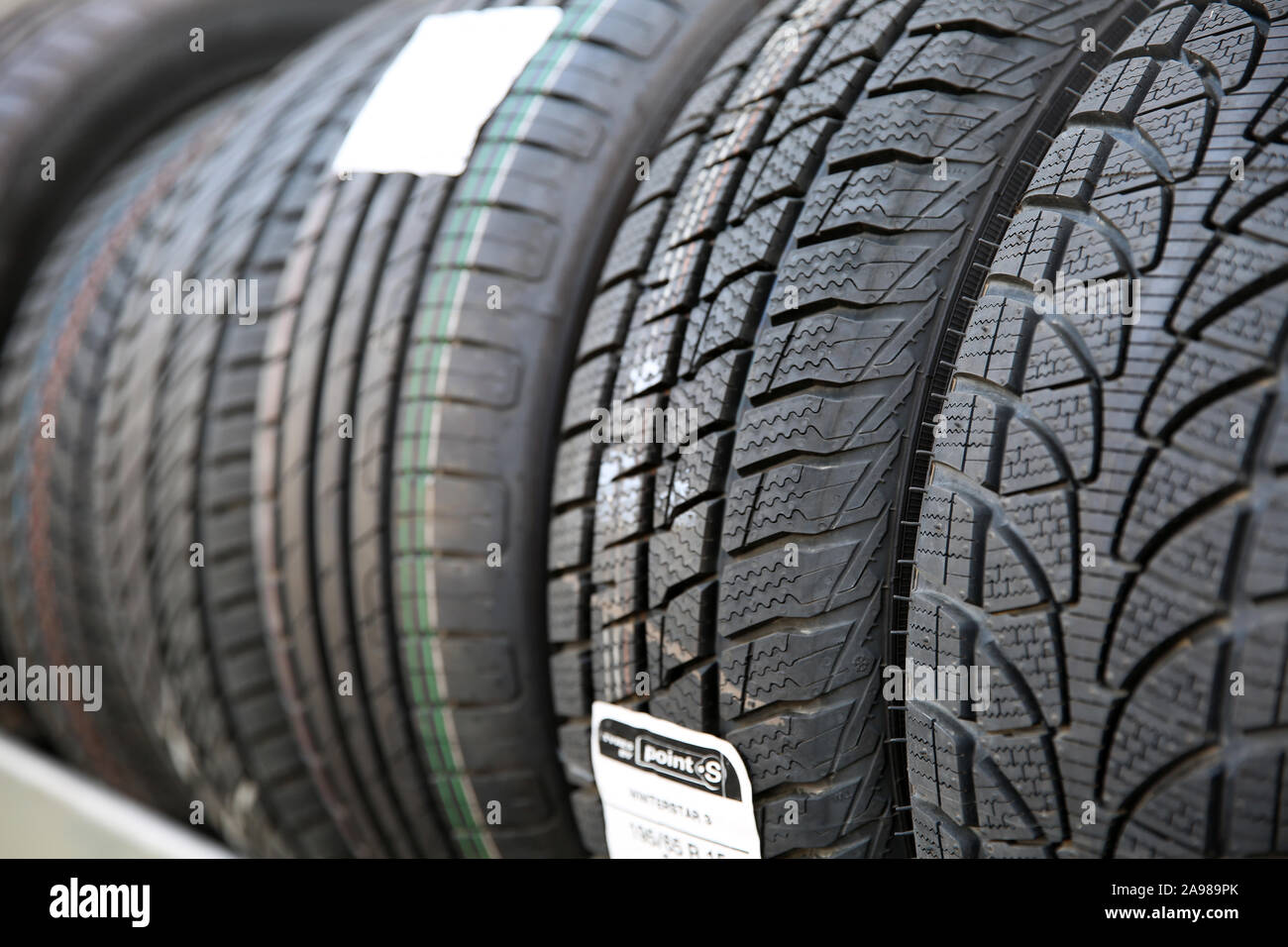 New tyres in a fitting garage, France Stock Photo - Alamy