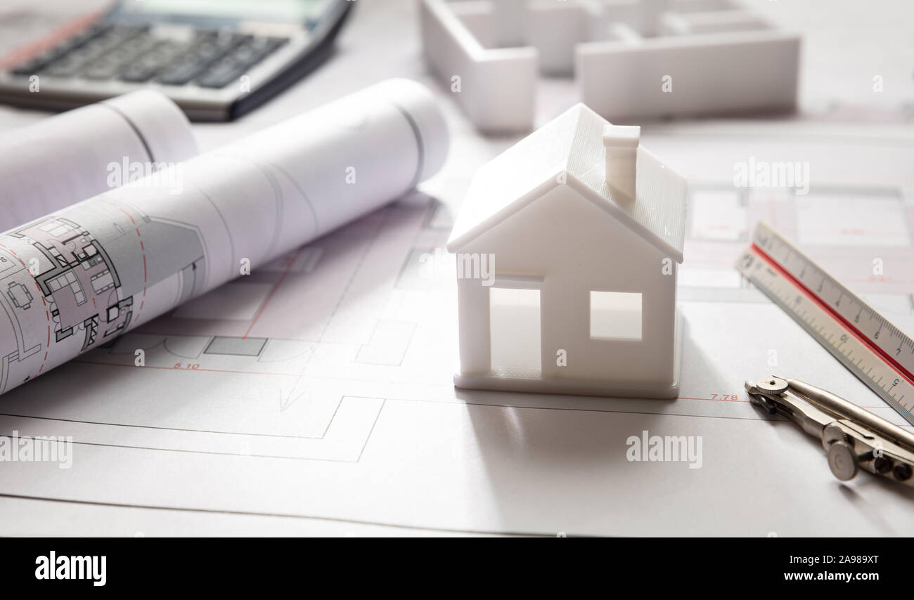House model and blueprint plans, residential building project ...