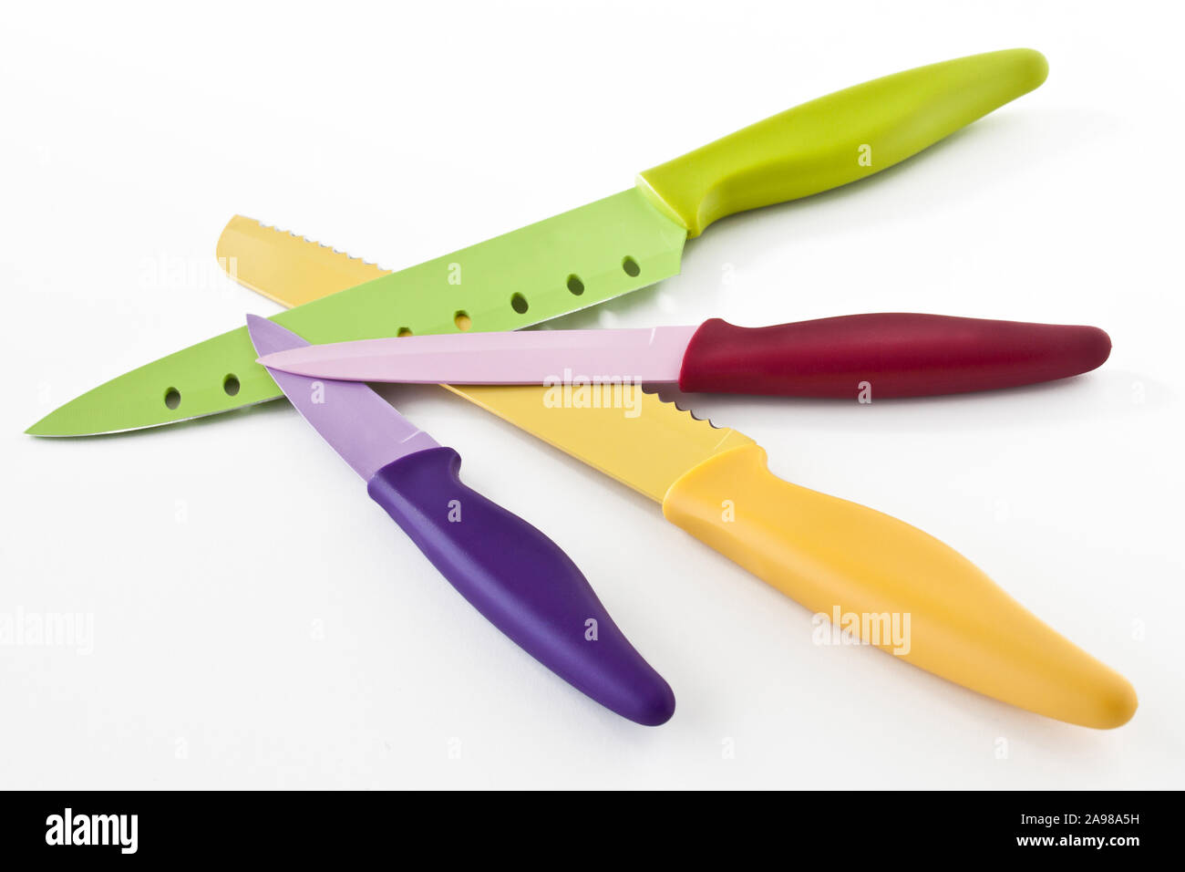 Various colorful kitchen knives on white background Stock Photo - Alamy