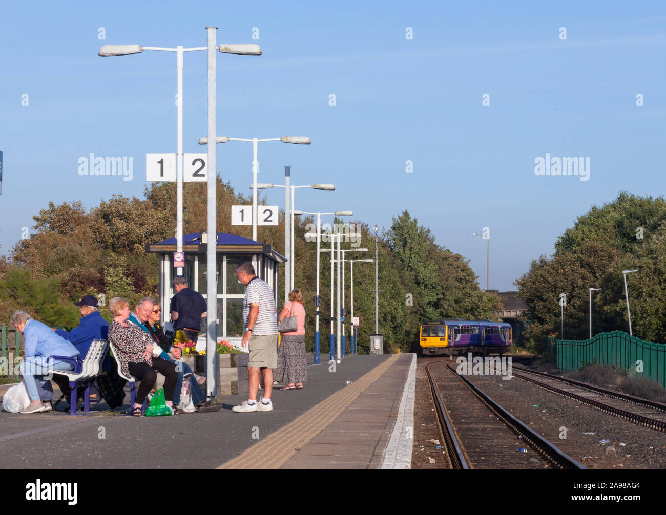 Arriva Northern Rail class 142 pacer train arriving at Morecambe railway station with rail ...