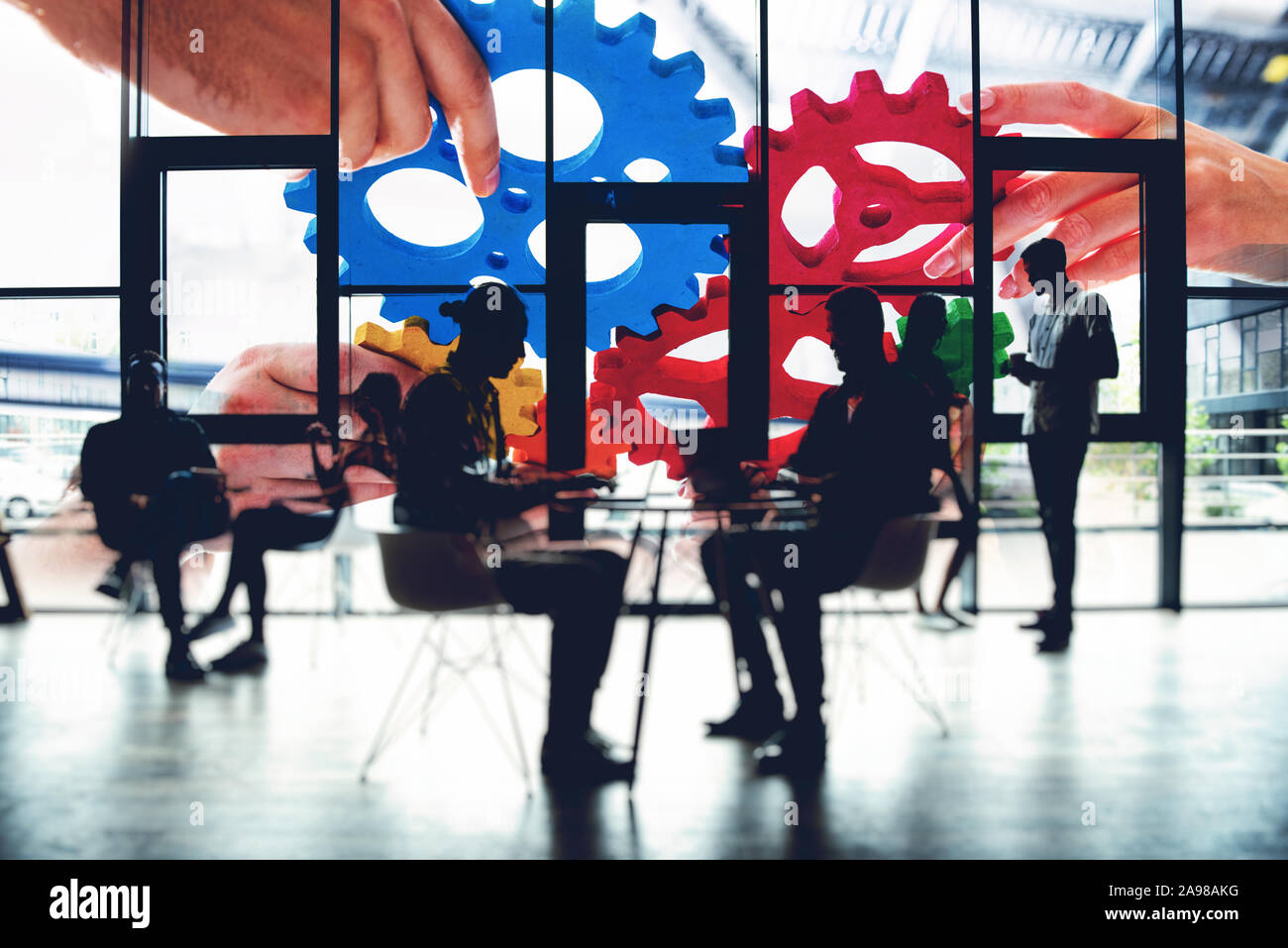 Business team connect pieces of gears. Teamwork, partnership and ...