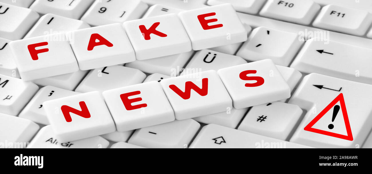 Fake News and warning sign Stock Photo - Alamy