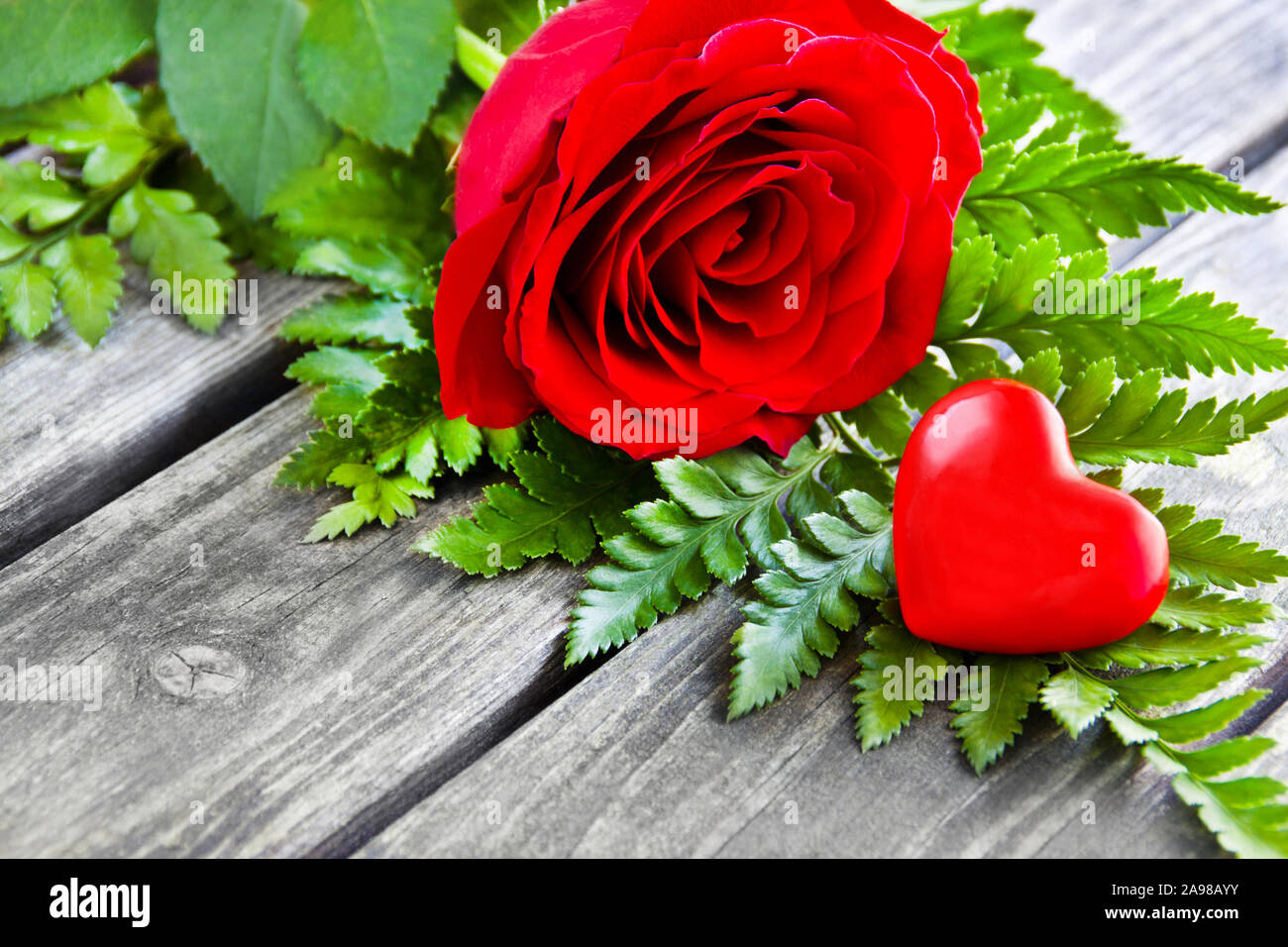 Red rose and heart Stock Photo - Alamy