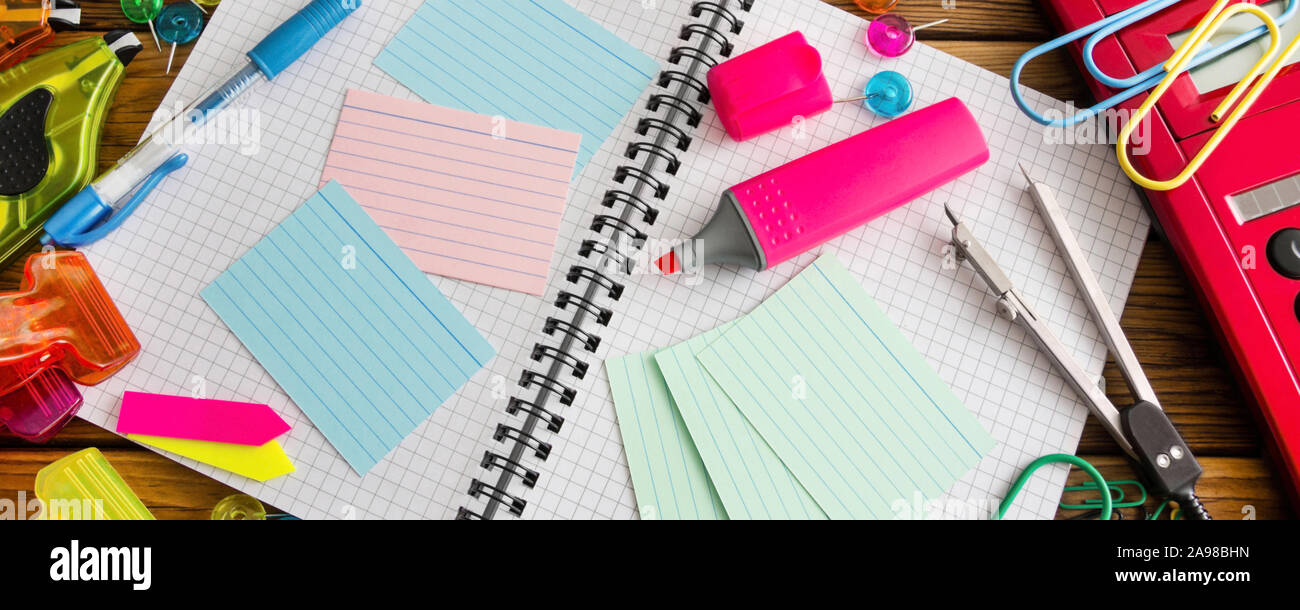 Desk and colorful stationery Stock Photo - Alamy