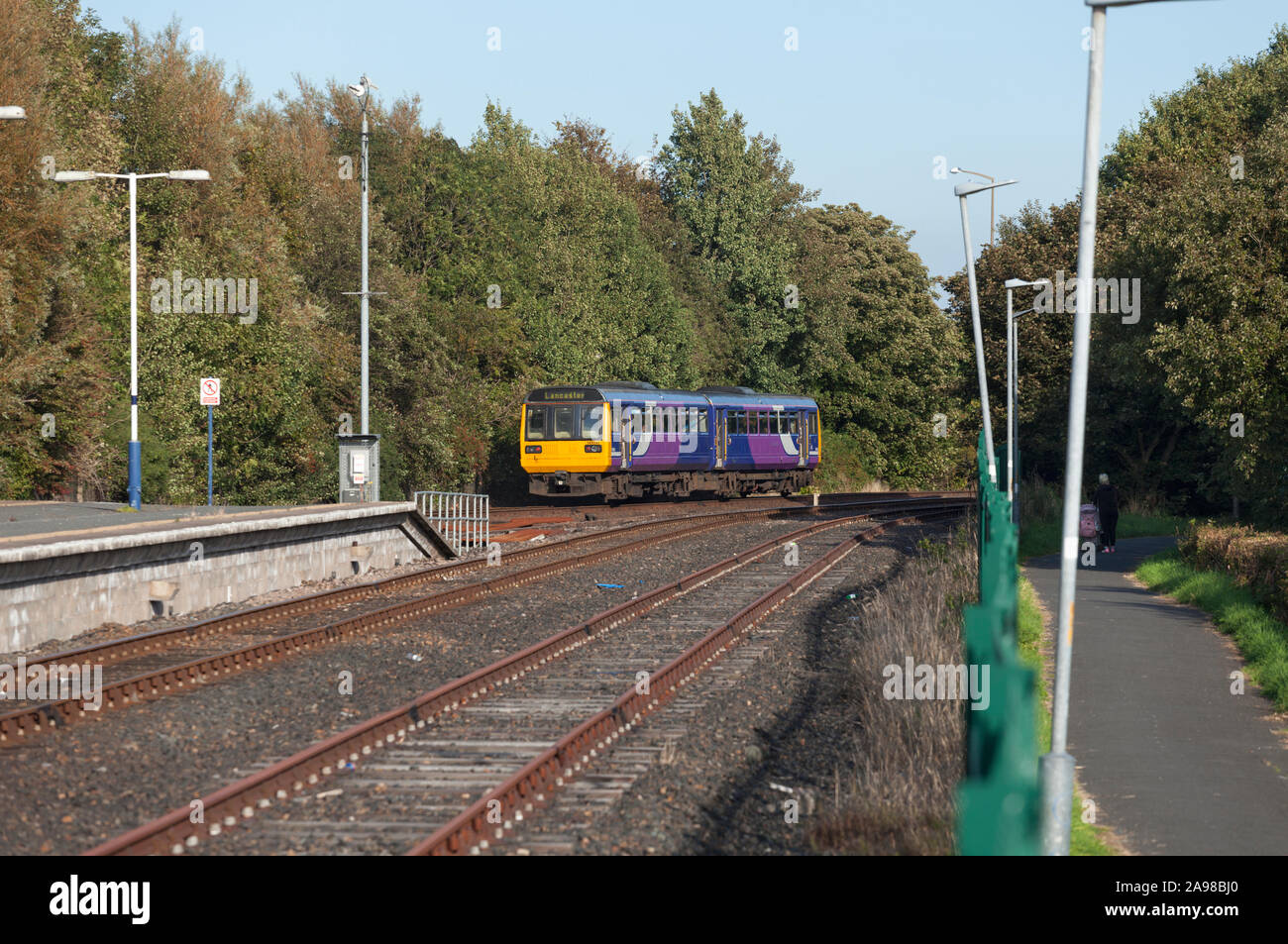 Arriva Northern Rail class 142 pacer train departing from Morecambe with a shuttle train to ...