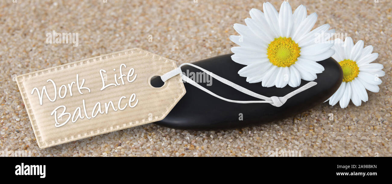 Work life balance label and hot stone Stock Photo - Alamy