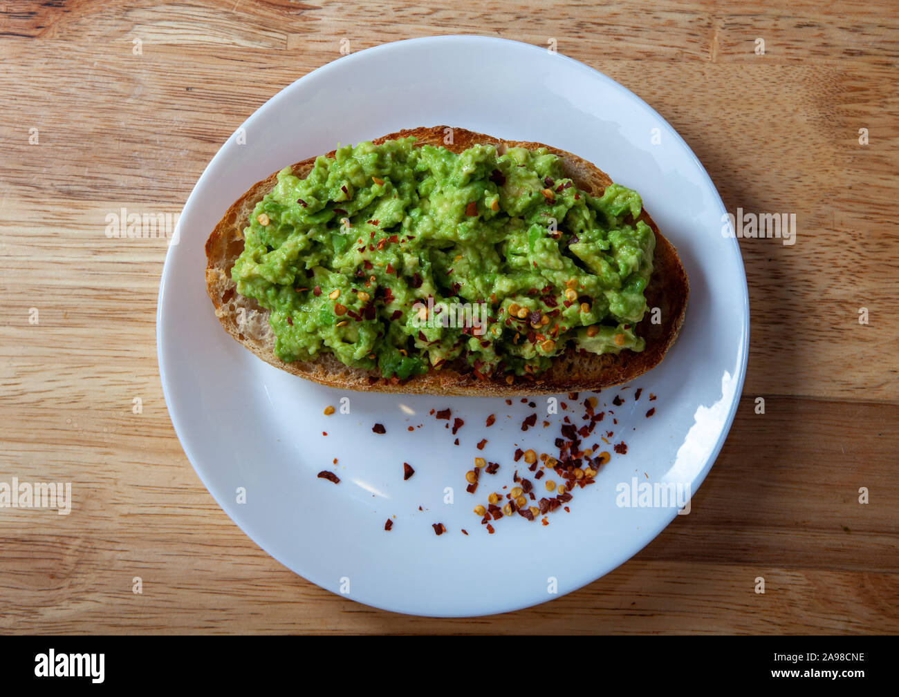 Avocado Toast with Red Pepper Flakes Stock Photo - Alamy