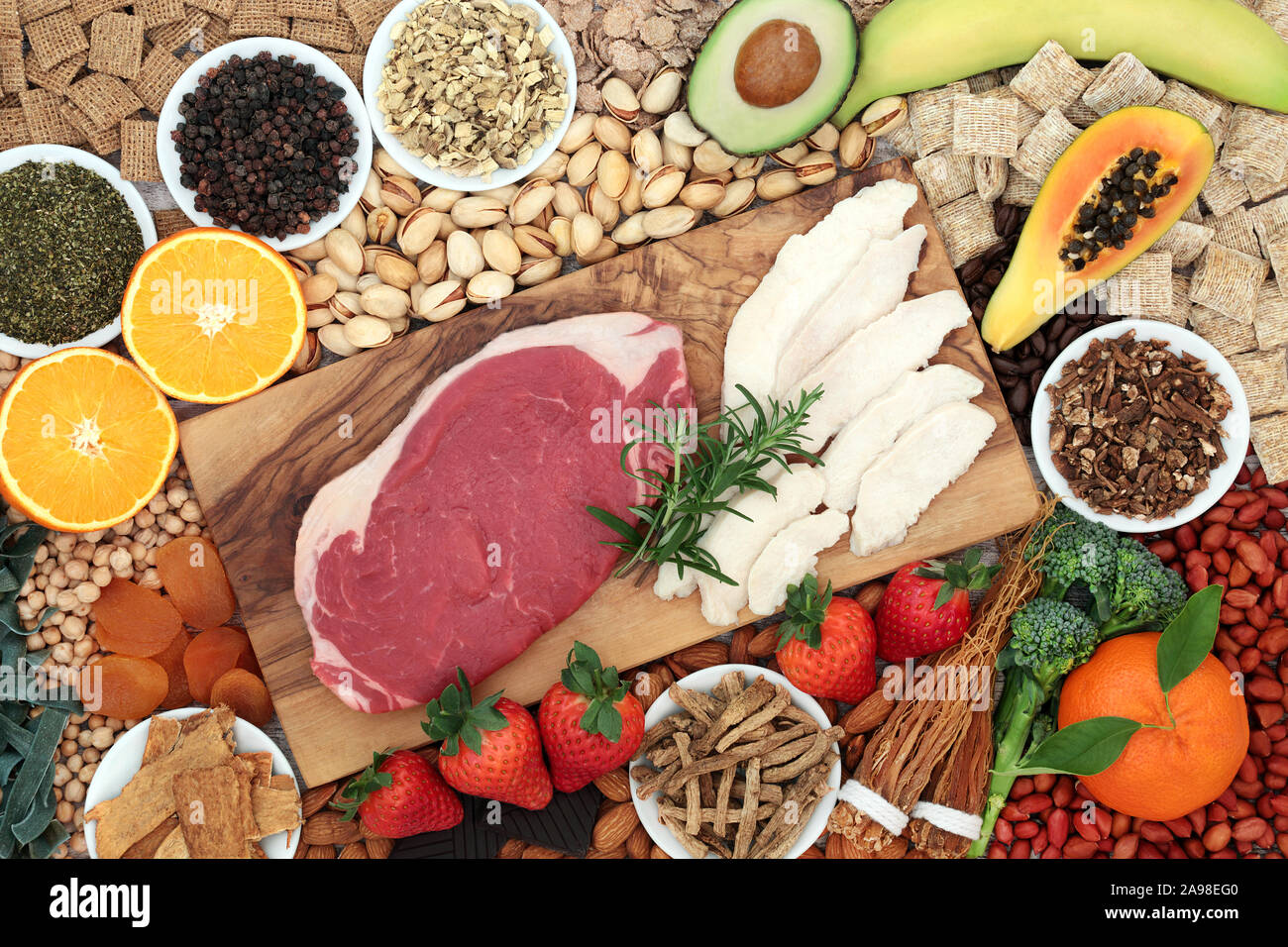 Health food for vitality & fitness with fruit, vegetables, meat, nuts ...