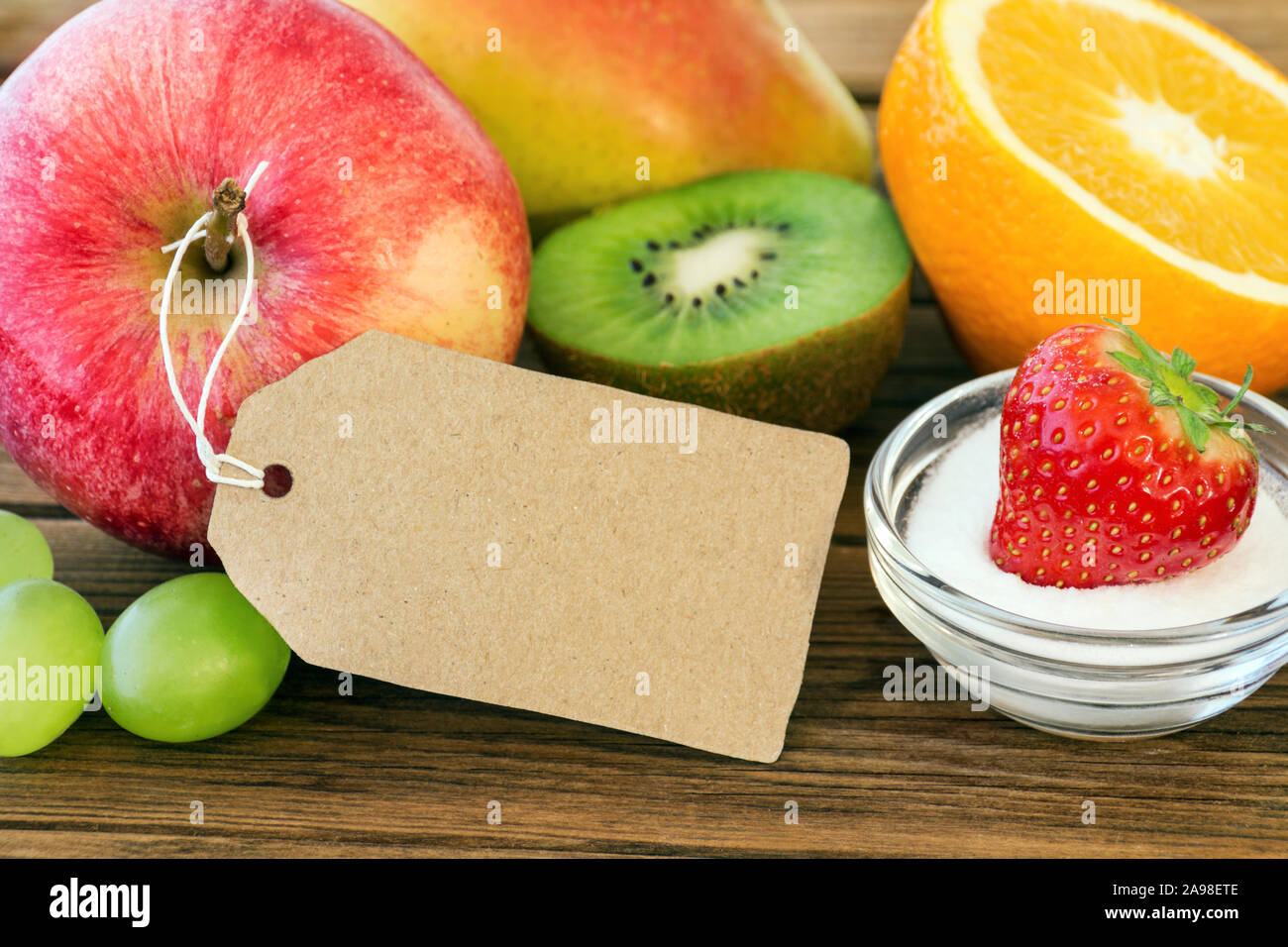 Fresh fruits with sugar and label Stock Photo - Alamy