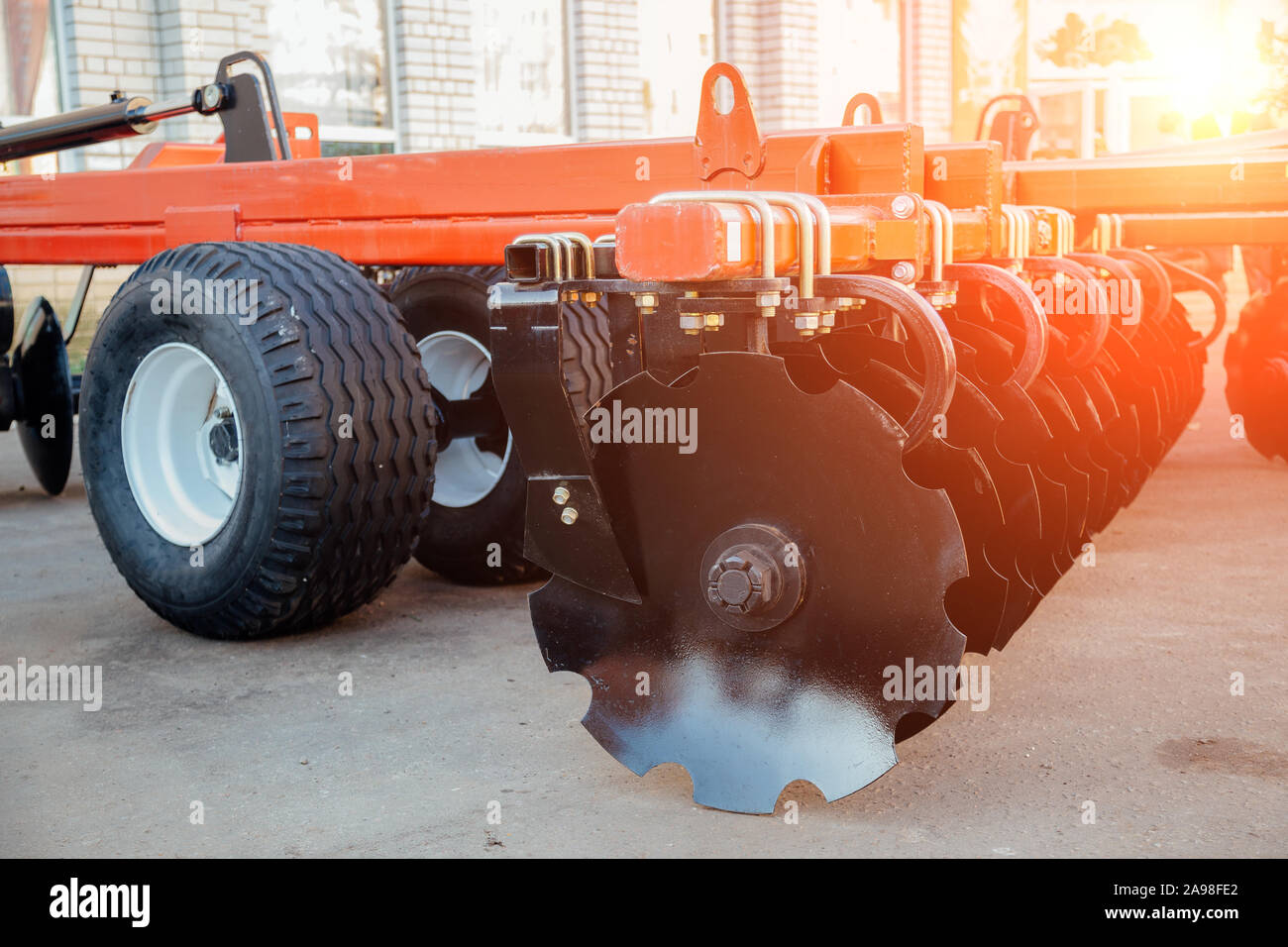 New modern agricultural disc harrow for tillage Stock Photo - Alamy