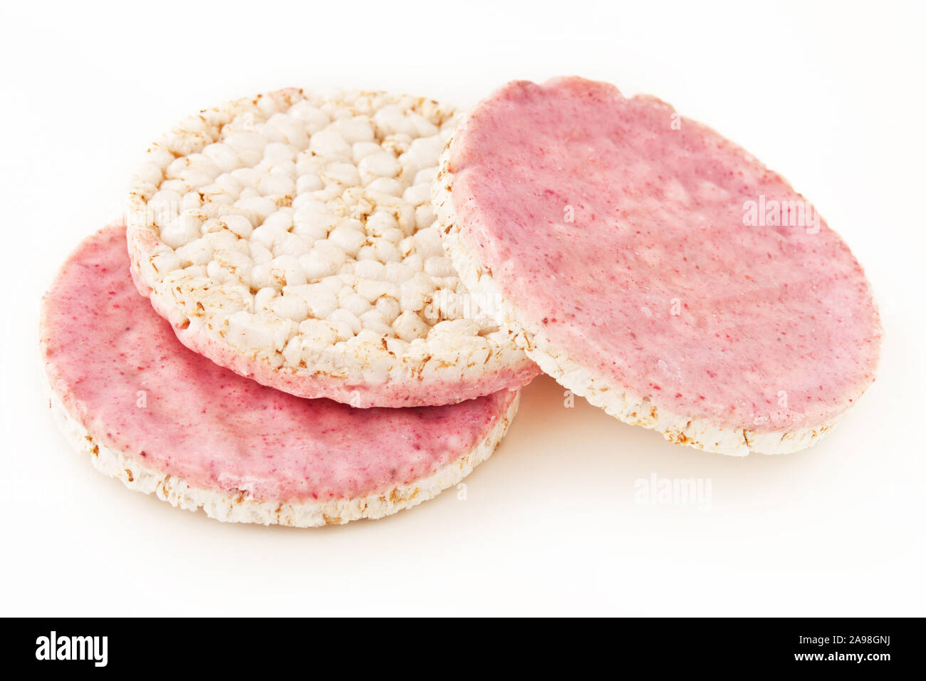 Three rice cakes with pink berry flavor Stock Photo - Alamy