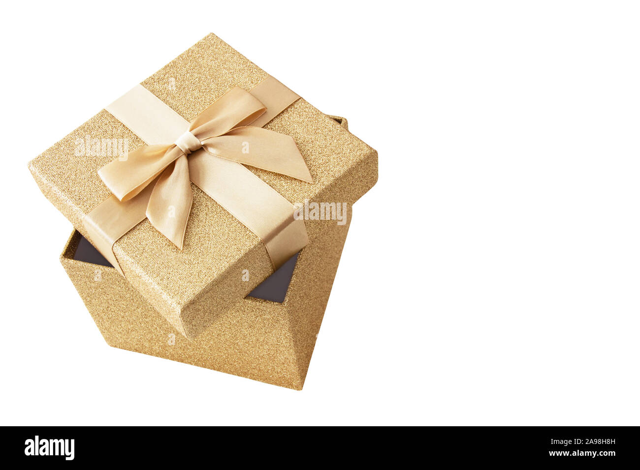 Golden gift against white background Stock Photo - Alamy