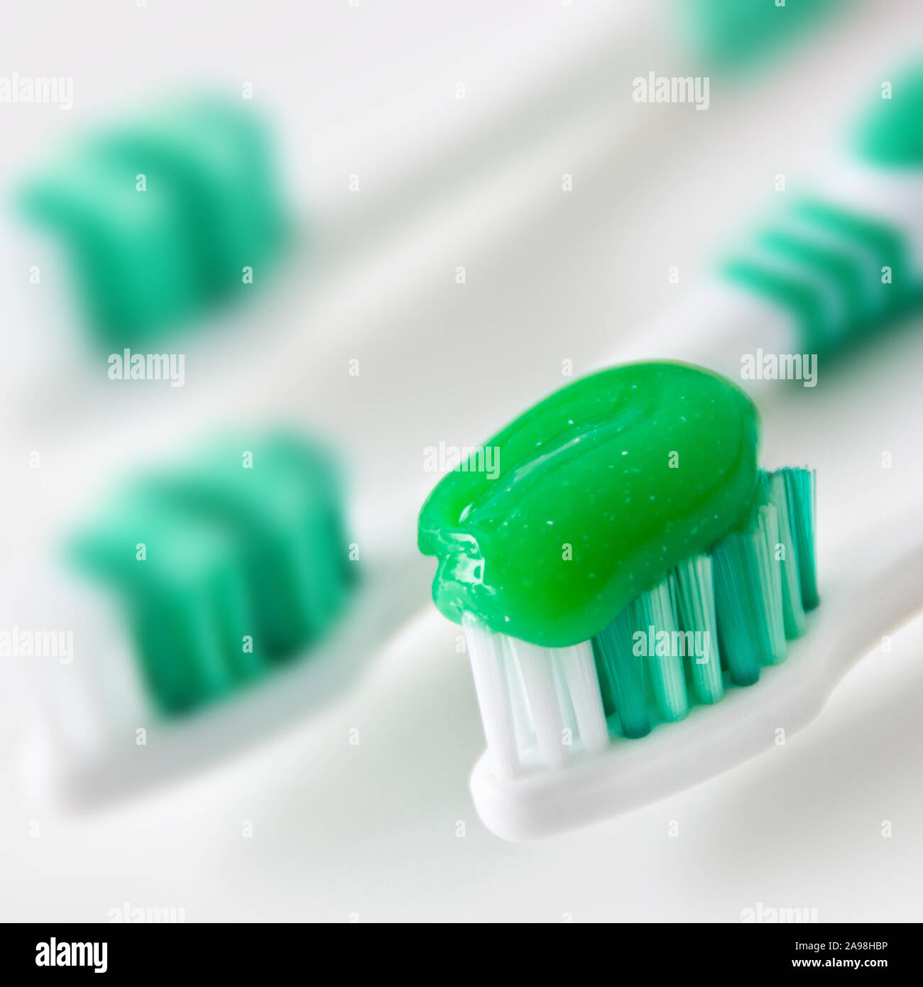Toothbrushes and toothpaste close up Stock Photo - Alamy