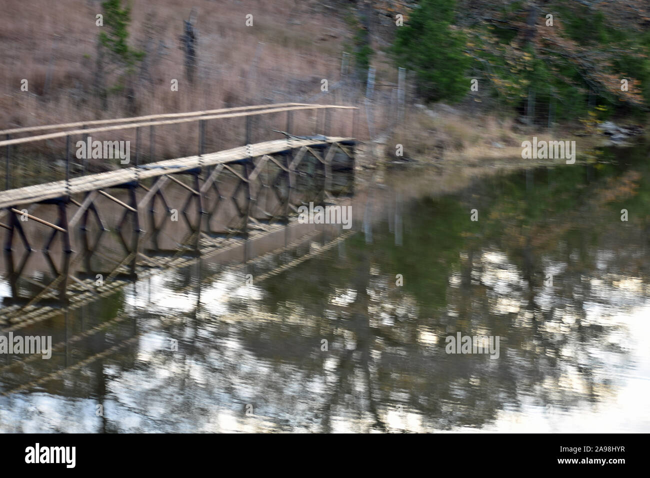 Footbridge over lake Stock Photo - Alamy