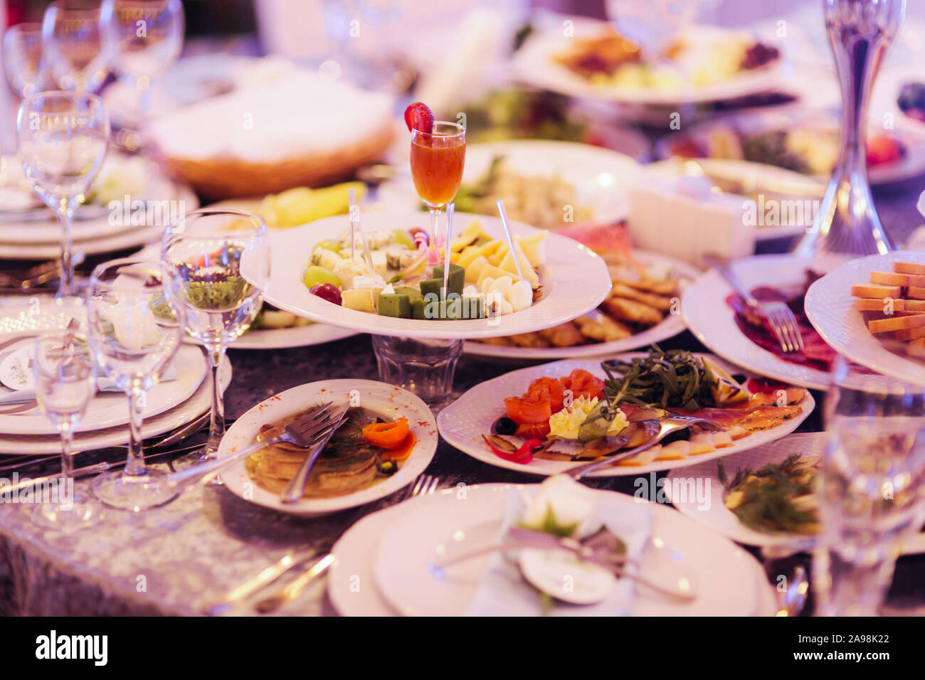 Table with mixed food. Banquet in restaurant, table setting. Differend ...
