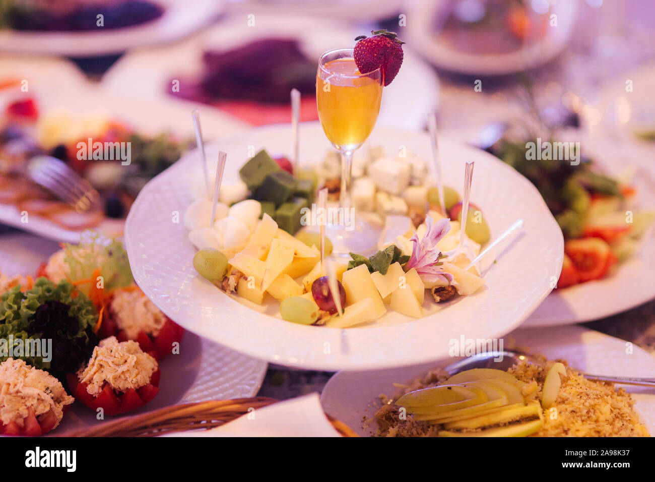 Table with mixed food. Banquet in restaurant, table setting. Differend ...