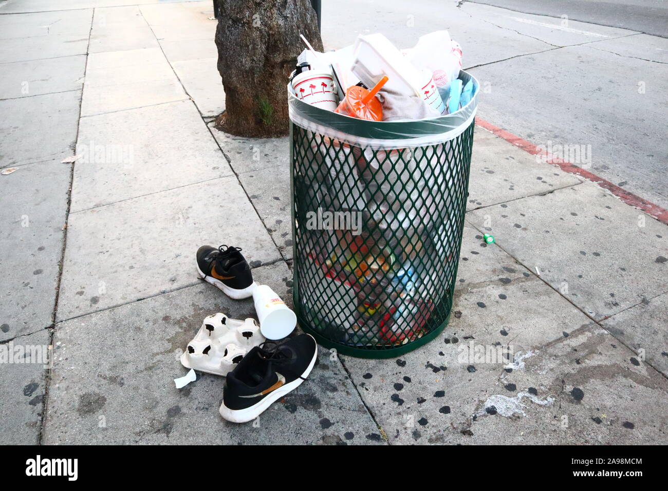 Full garbage can on Sunset Boulevard, Hollywood Stock Photo - Alamy