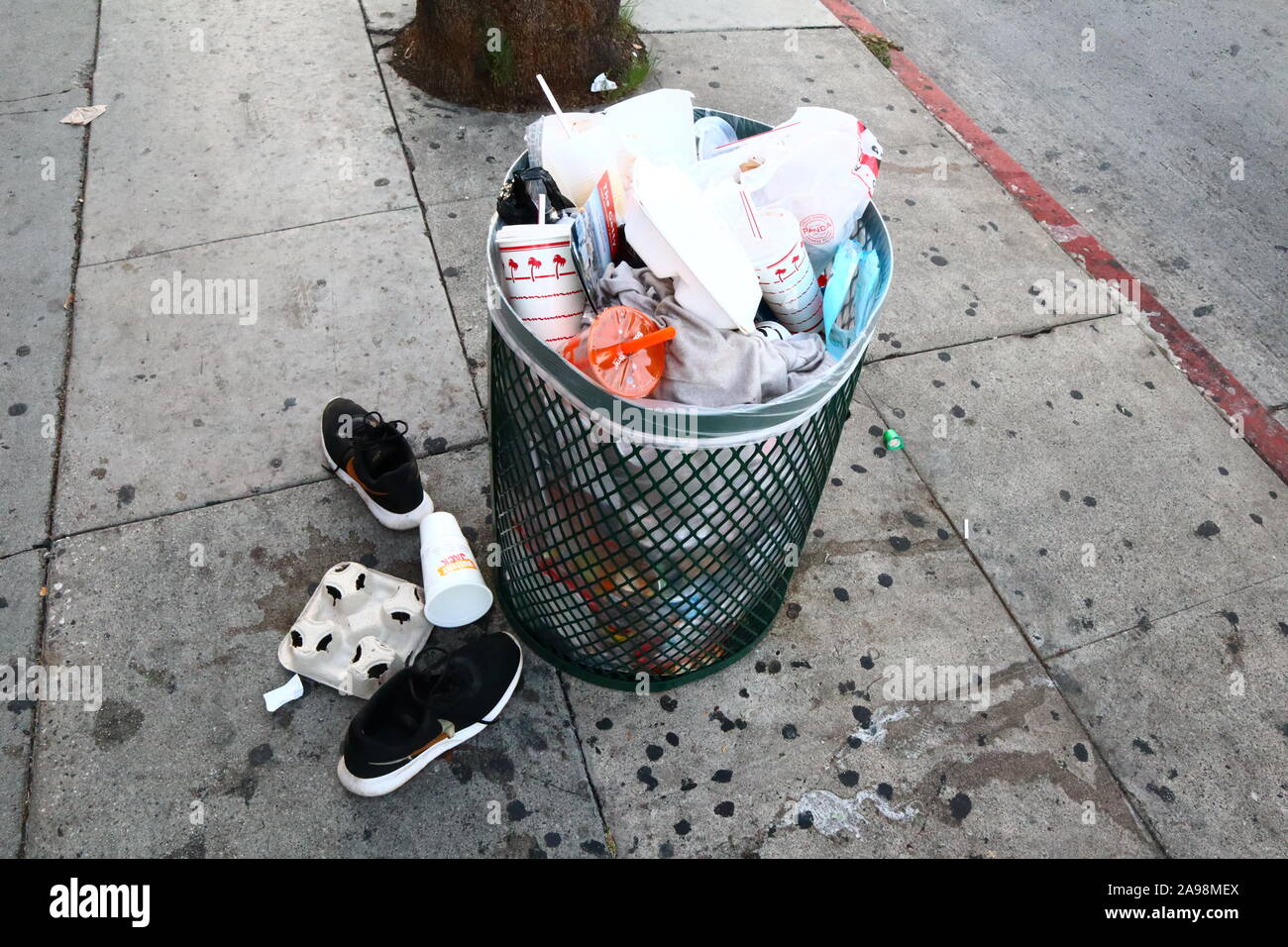 Full garbage can on Sunset Boulevard, Hollywood Stock Photo - Alamy