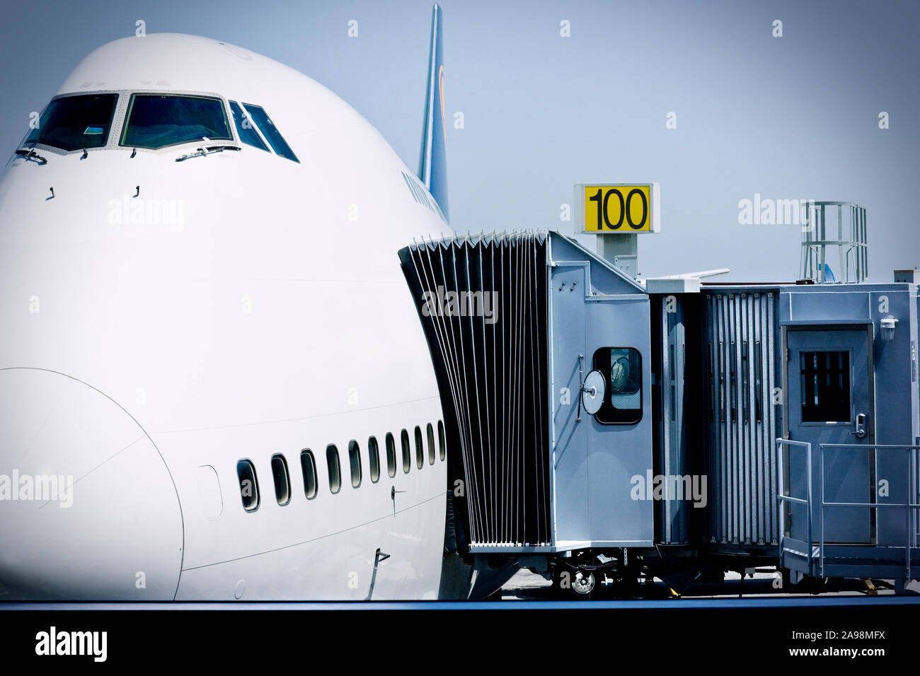 Moveable boarding corridor attached to the side of a large passenger ...
