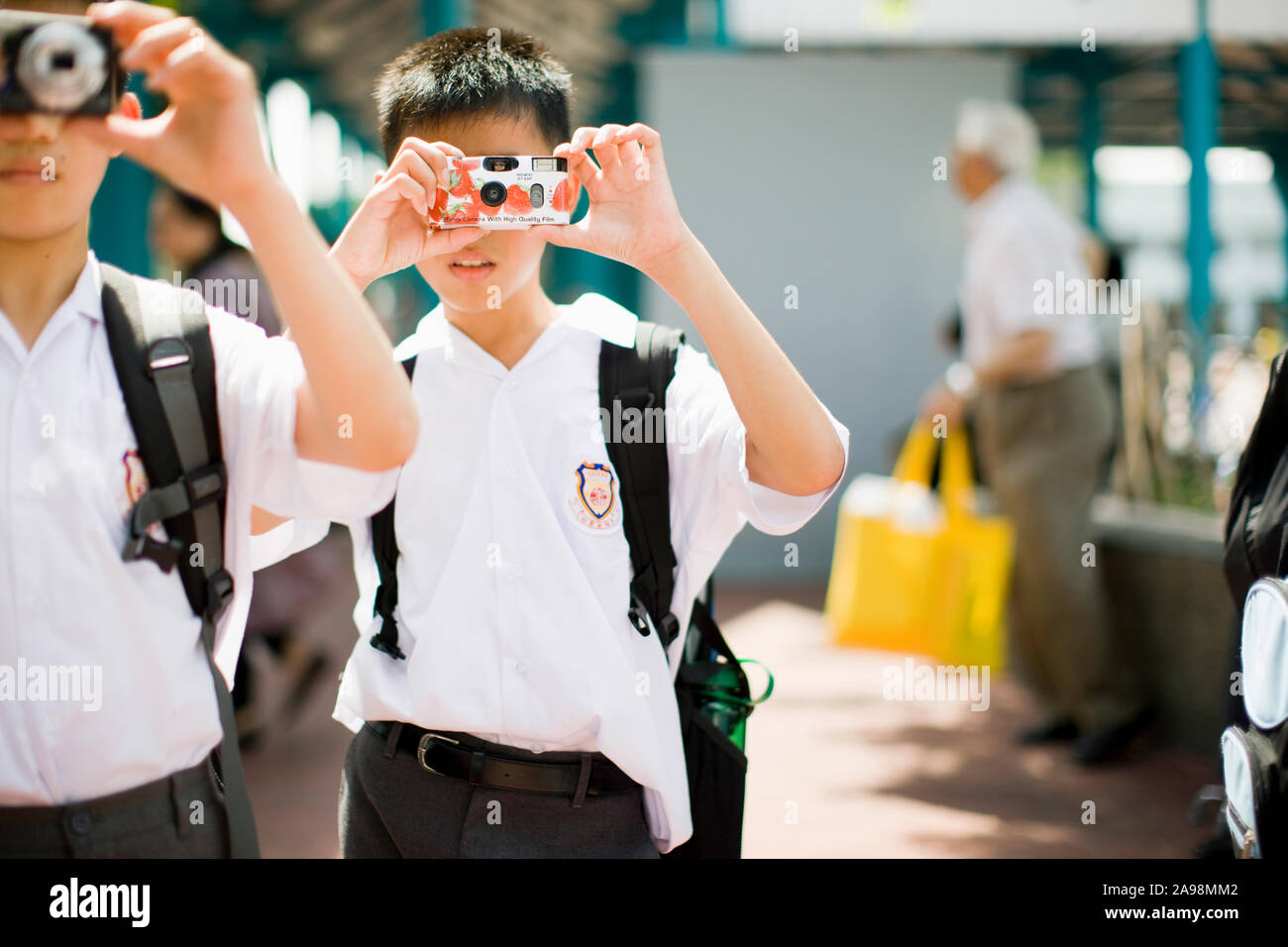 Kids taking photos on a school trip Stock Photo - Alamy
