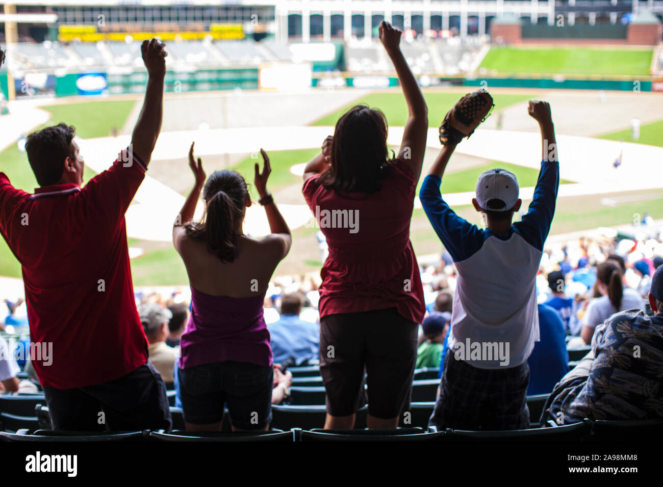 Family cheering on a baseball game at a sports stadium Stock Photo - Alamy