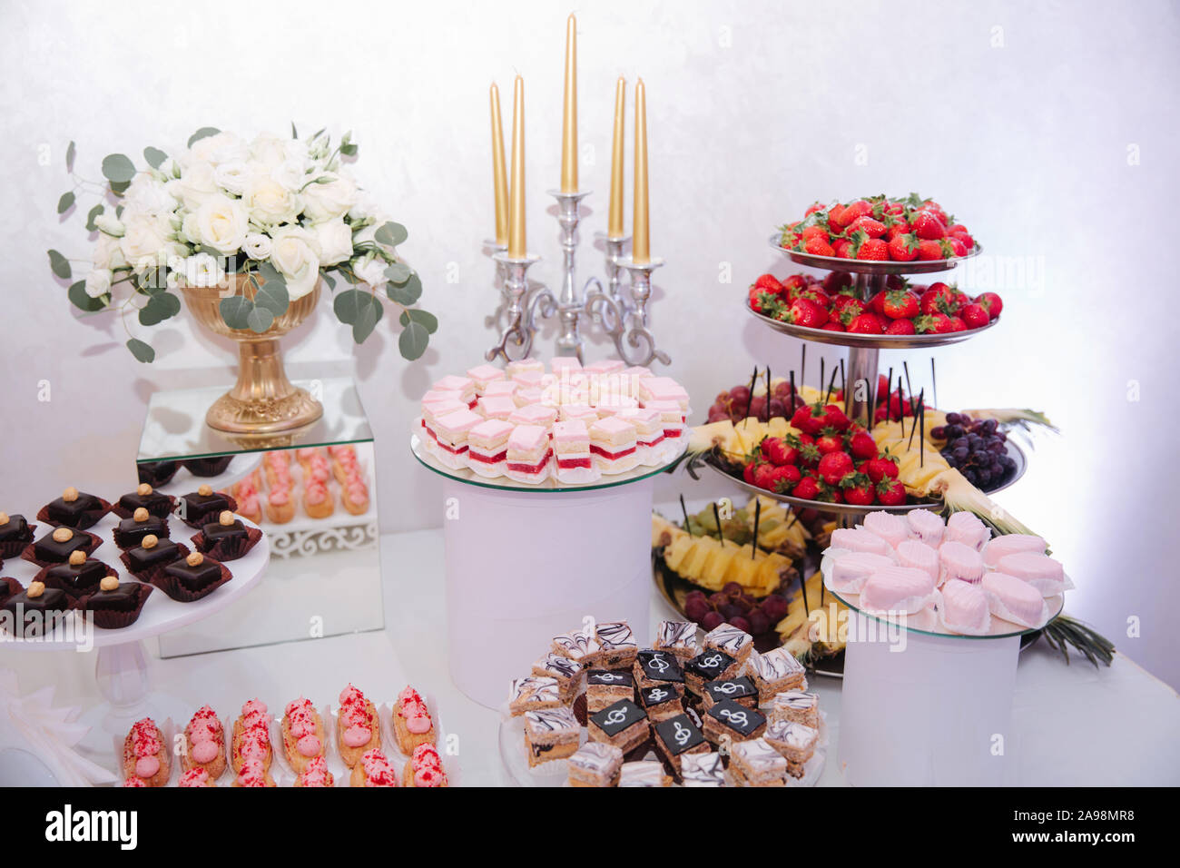 Sweet desert on the table. Different desserts on candy bar Stock Photo ...