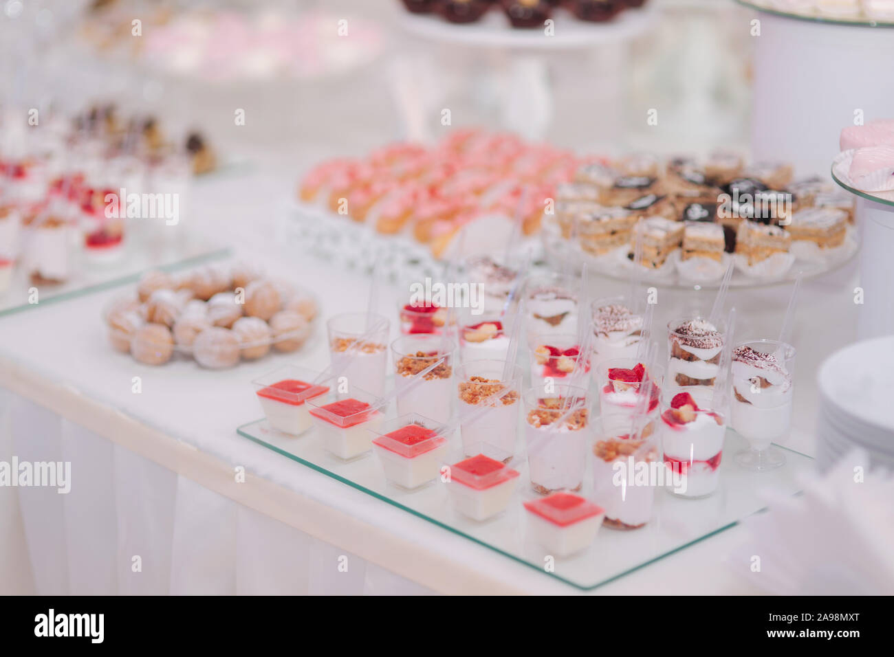 Sweet desert on the table. Different desserts on candy bar Stock Photo ...