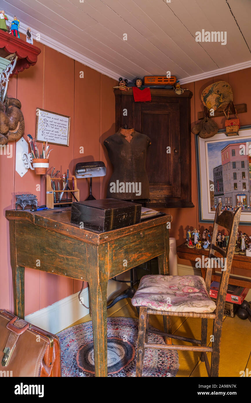 Antique wooden desk and chair in upstairs salmon coloured workroom with ...