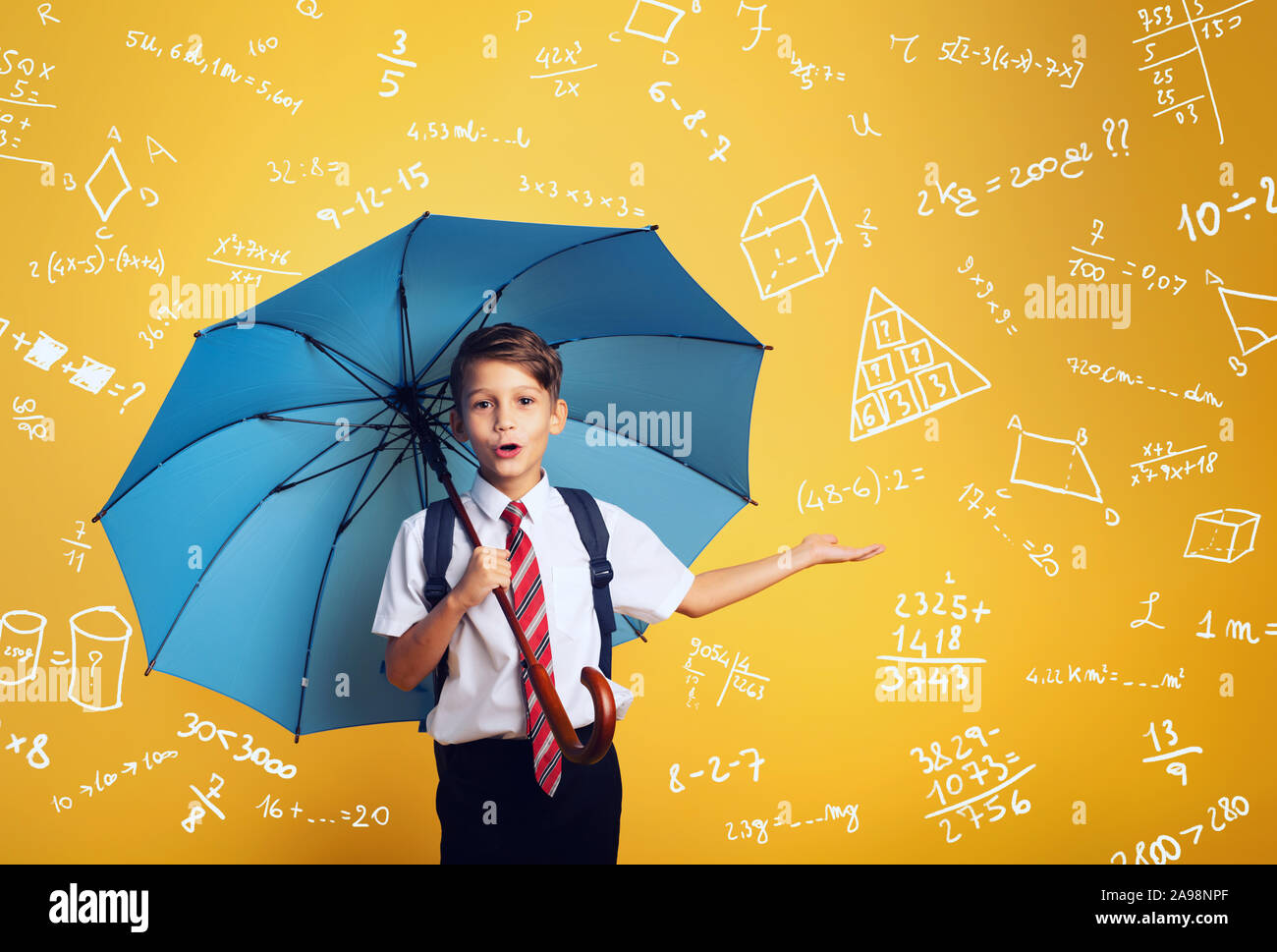 Child student with blue umbrella cover himself from a rain of math and ...