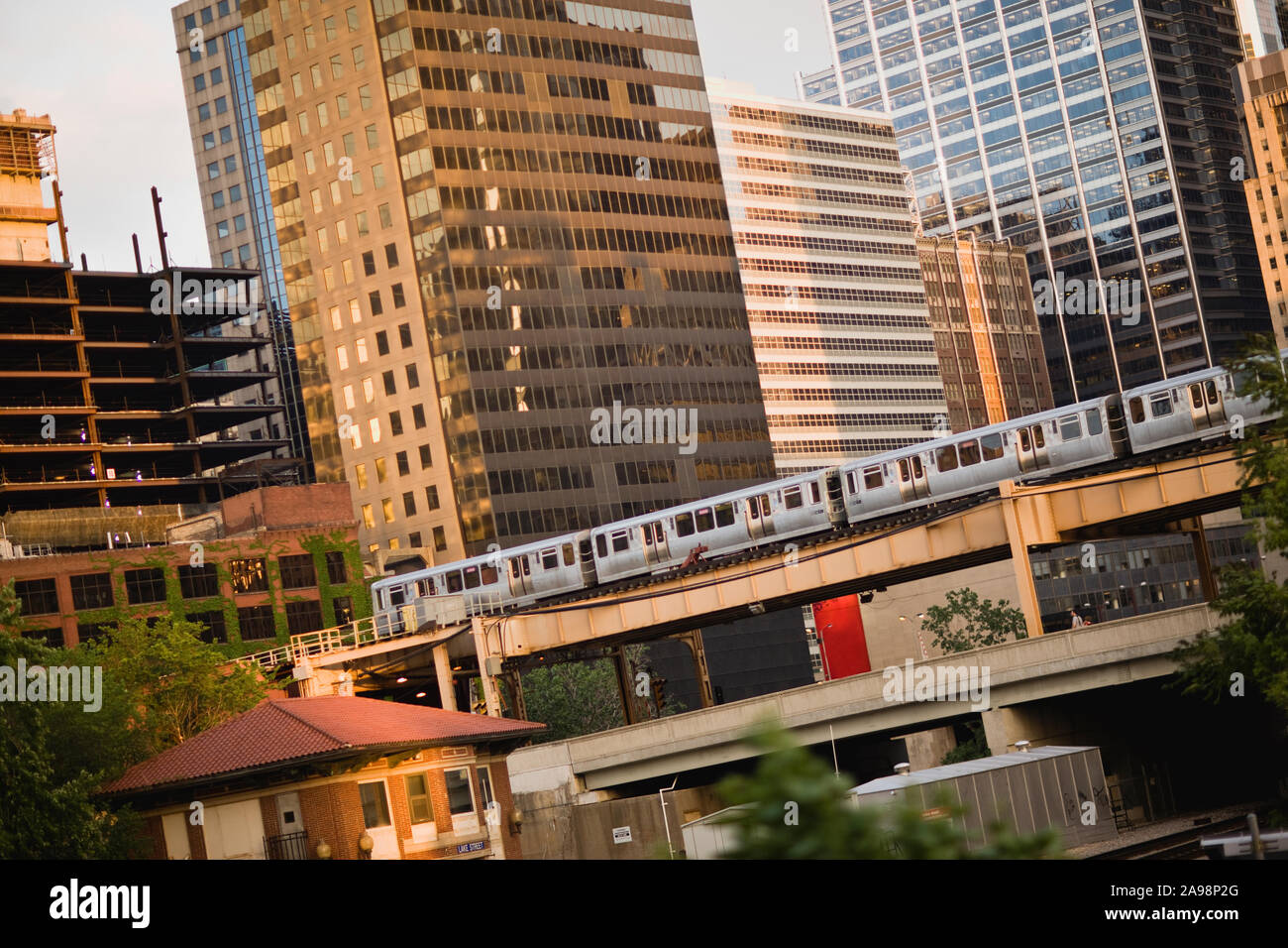 Train travelling through a large city Stock Photo - Alamy