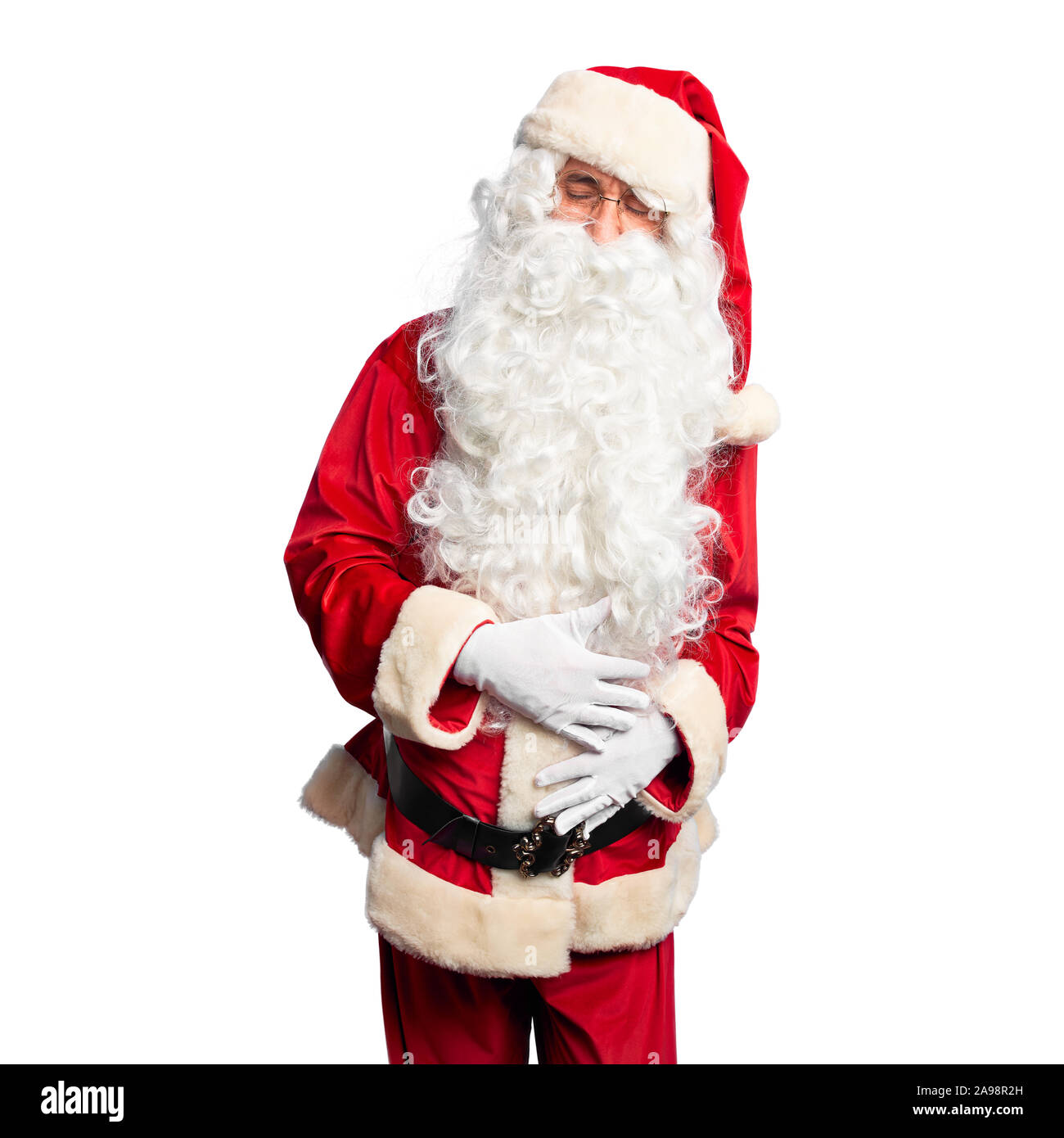 Middle age handsome man wearing Santa Claus costume and beard standing ...