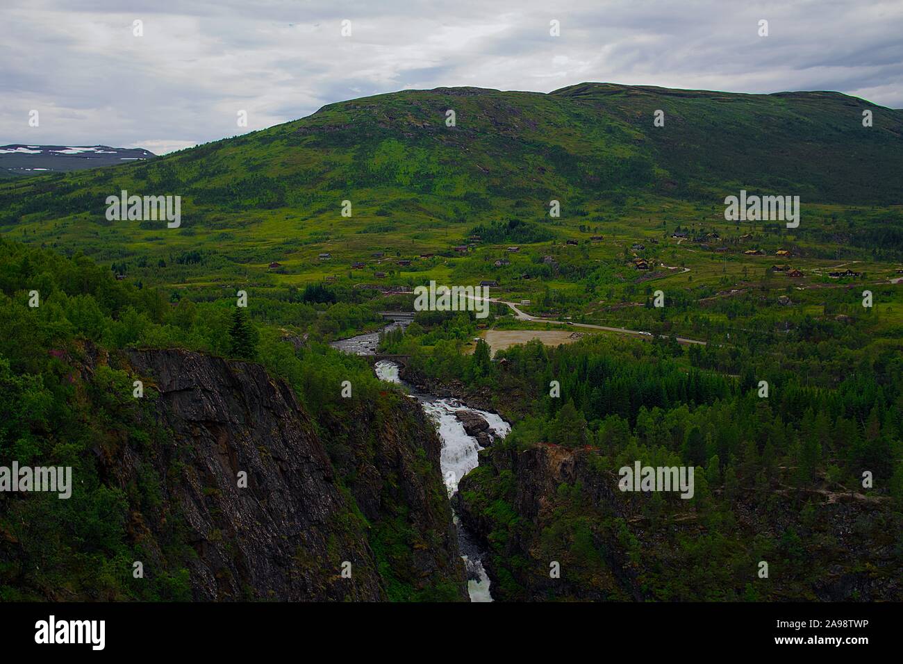Cloudy sky, water falling below Stock Photo - Alamy
