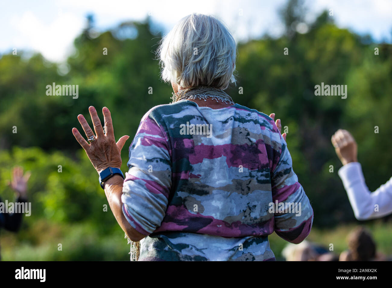 Selective focus of middle aged woman practicing yoga and mindfulness in ...