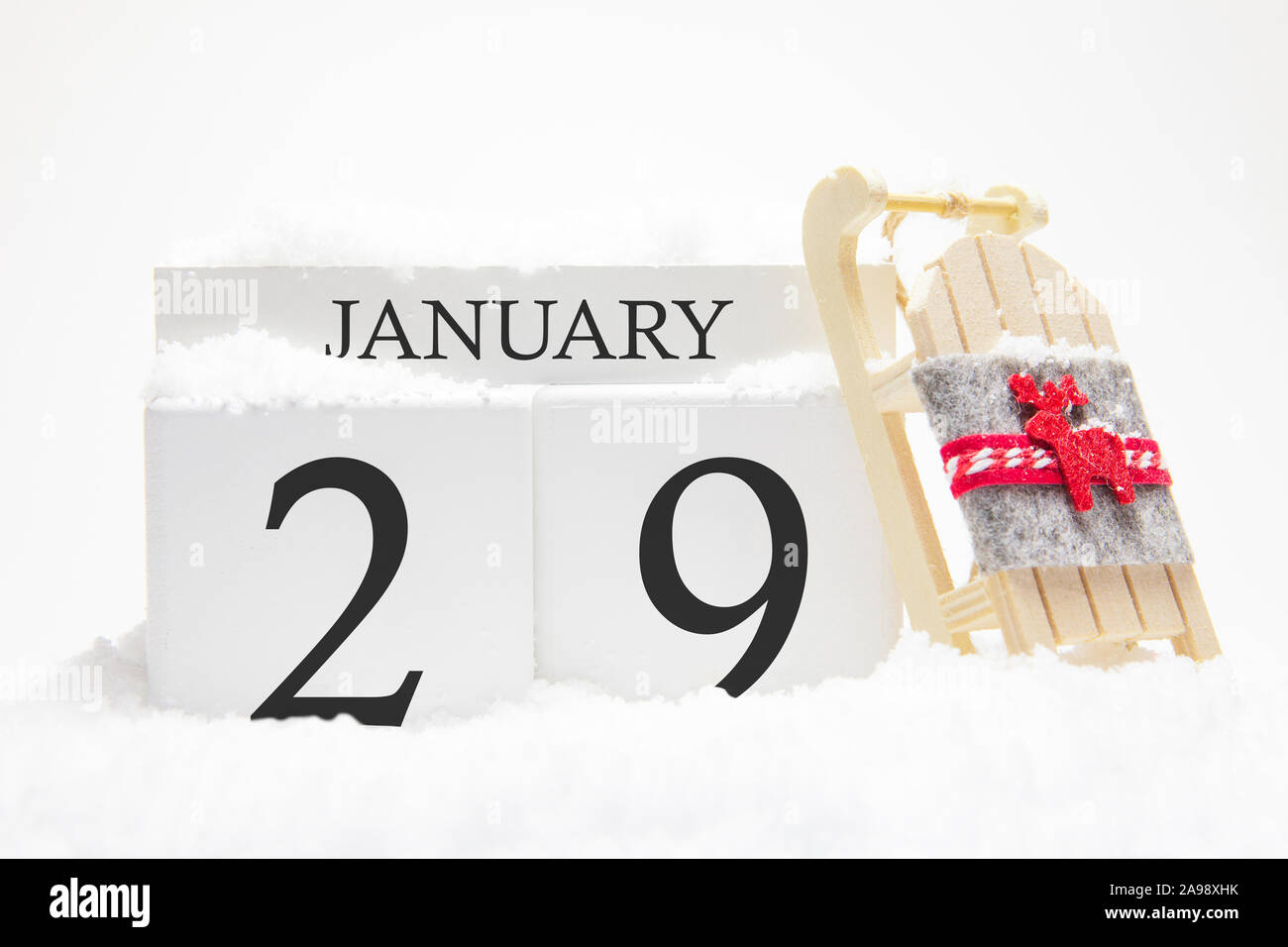 Wooden calendar for January, 29 th day of the winter month. The symbols ...