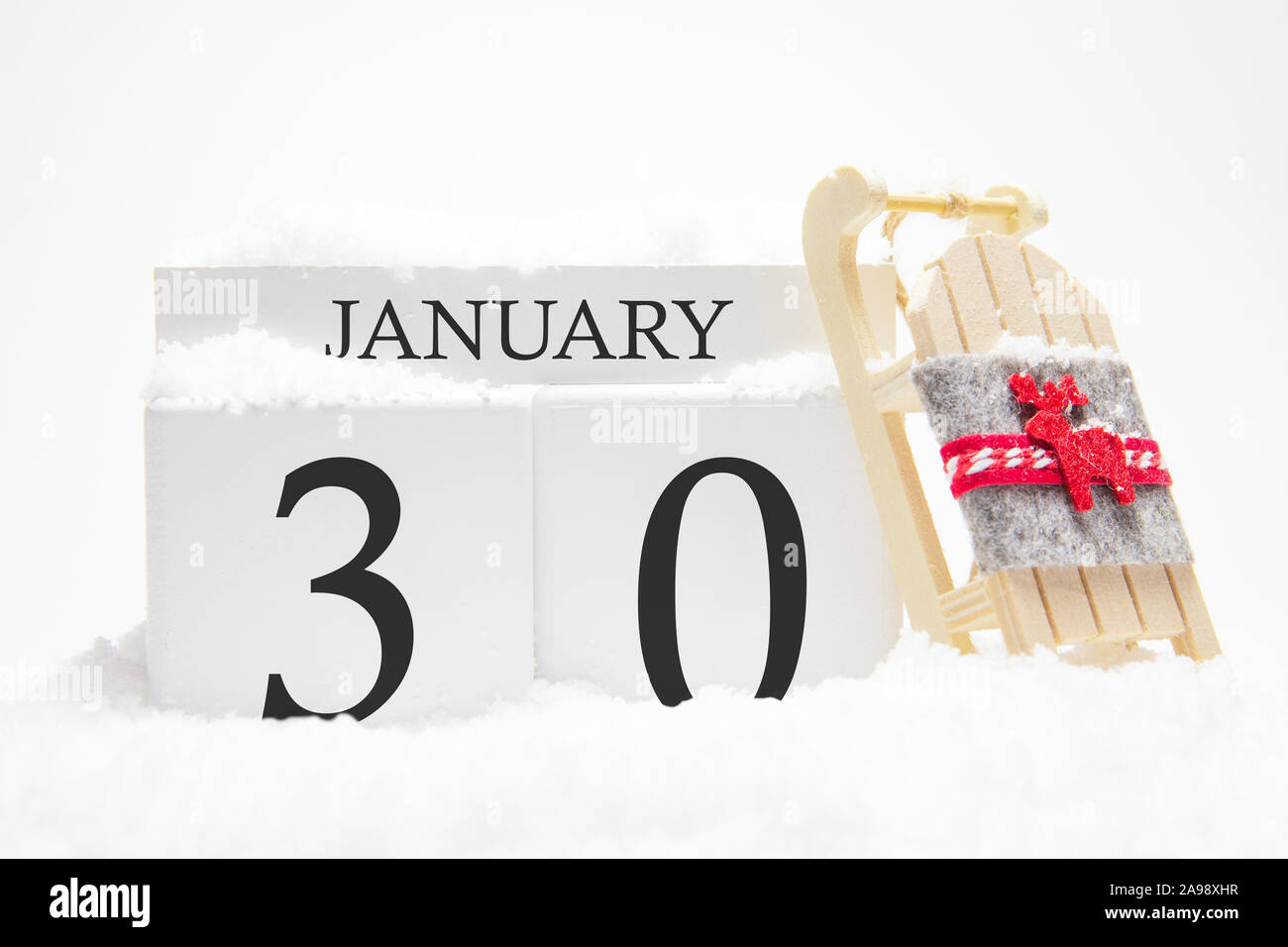 Wooden calendar for January, 30 th day of the winter month. The symbols ...