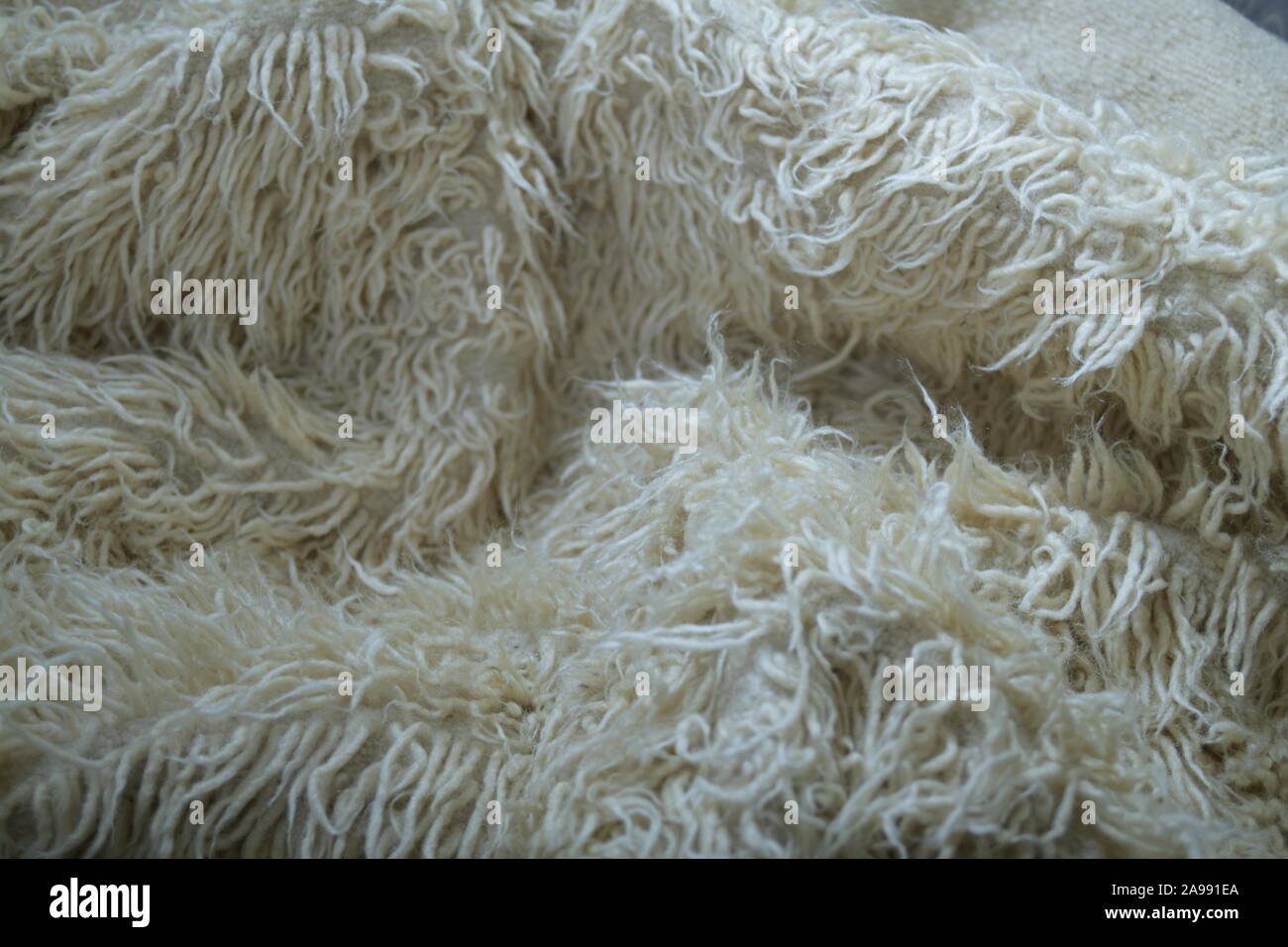 Cozy fluffy background in cream tones. White wool with white top ...