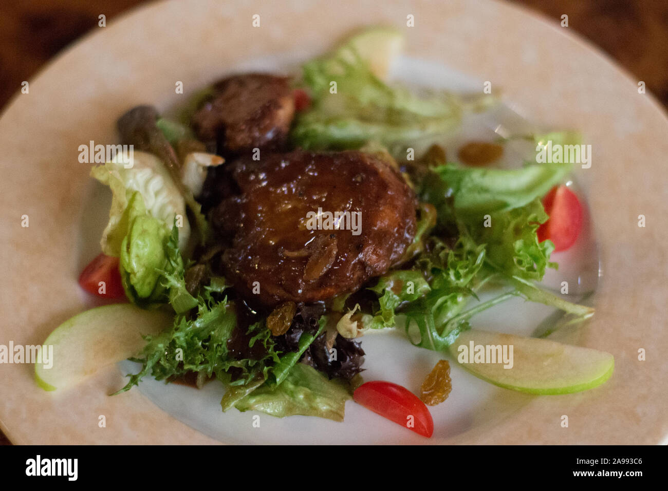 Pan fried foie gras goose liver on a bed of liver Stock Photo - Alamy