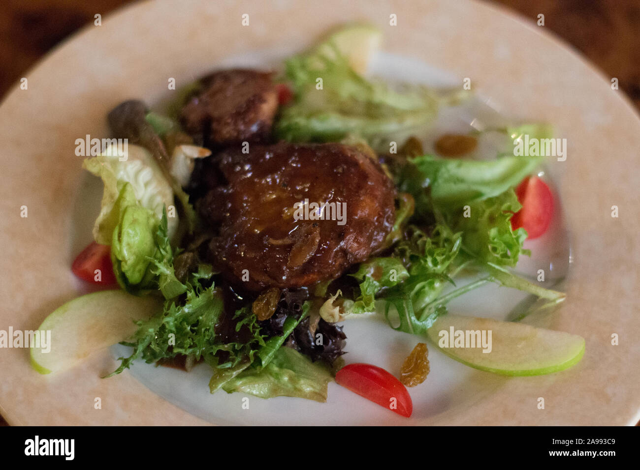 Pan fried foie gras goose liver on a bed of liver Stock Photo - Alamy