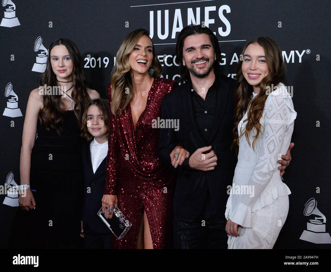 Las Vegas, United States. 13th Nov, 2019. Honoree Juanes (2nd R), Karen ...