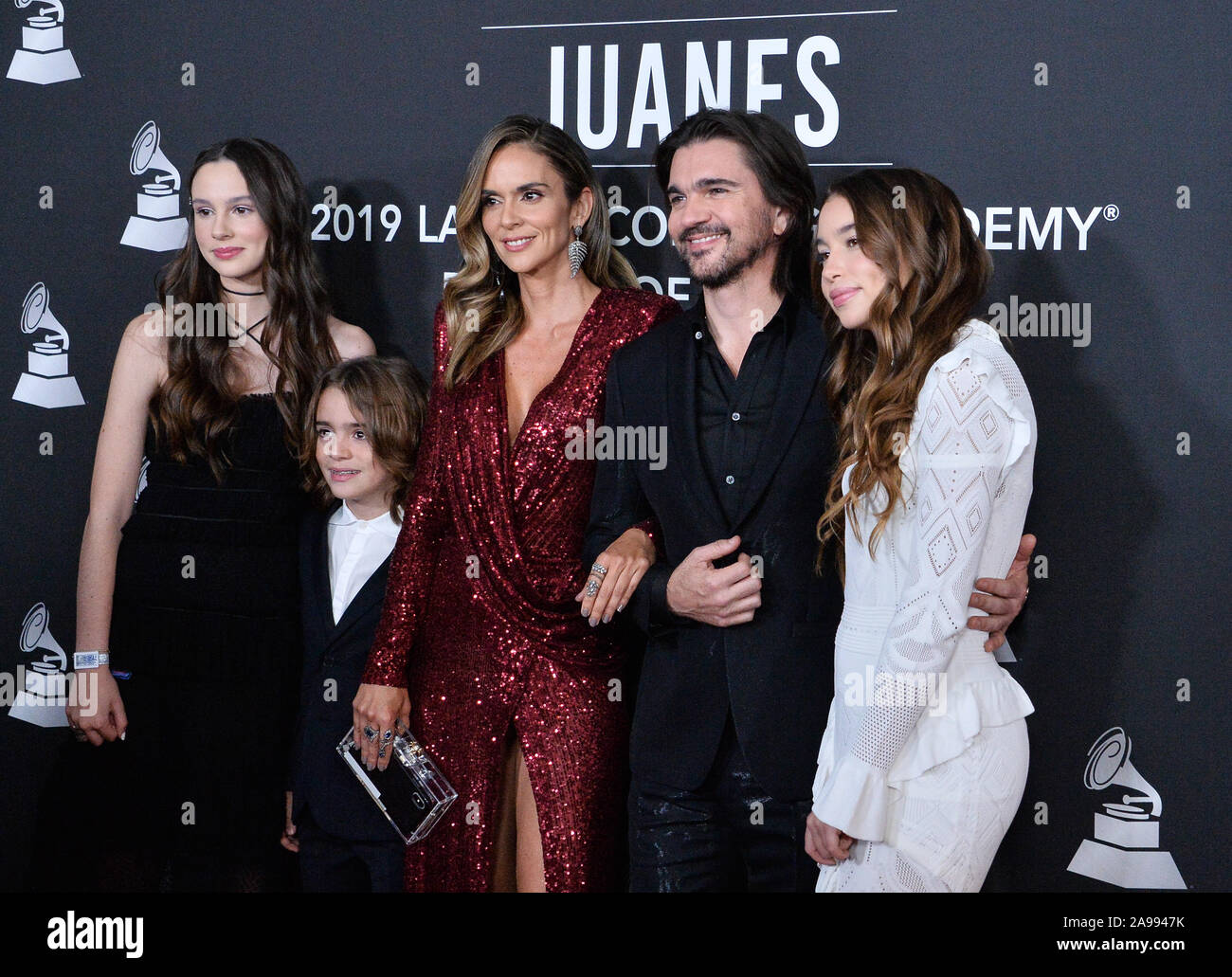 Las Vegas, United States. 13th Nov, 2019. Honoree Juanes (2nd R), Karen ...