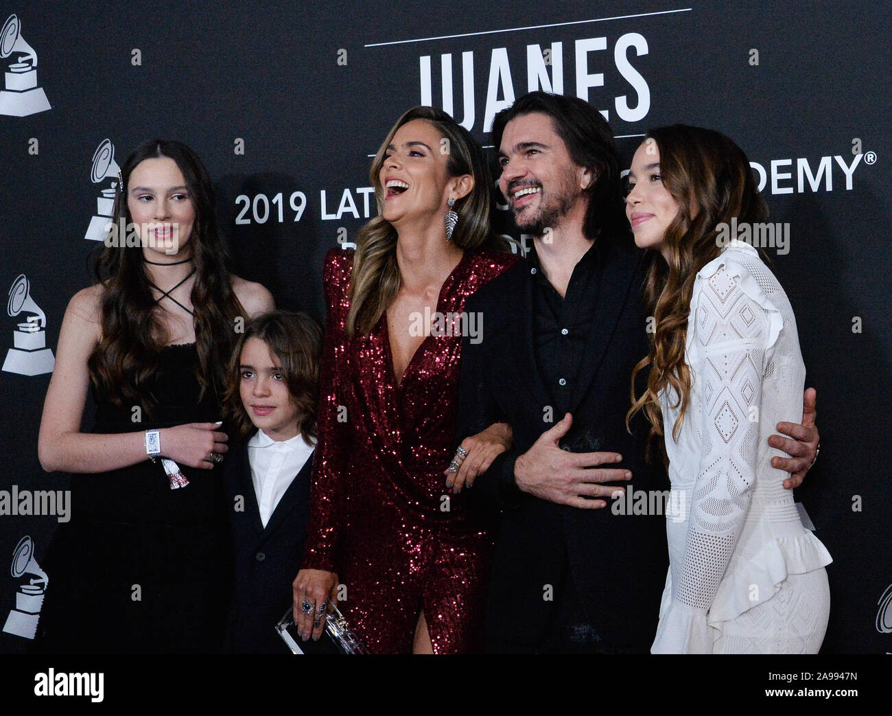 Las Vegas, United States. 13th Nov, 2019. Honoree Juanes (2nd R), Karen ...